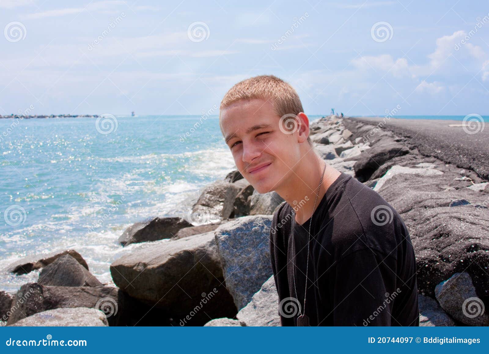 Young Man on the Jetty stock image. Image of vacation - 20744097