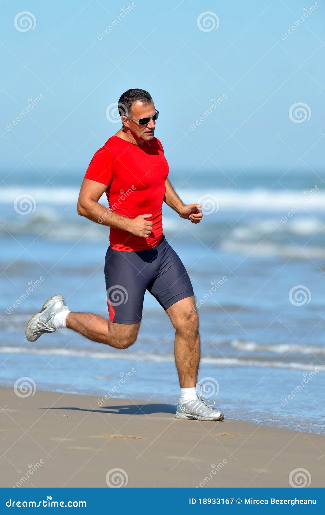Young Man Jogging on the Beach Stock Image - Image of sunshine ...
