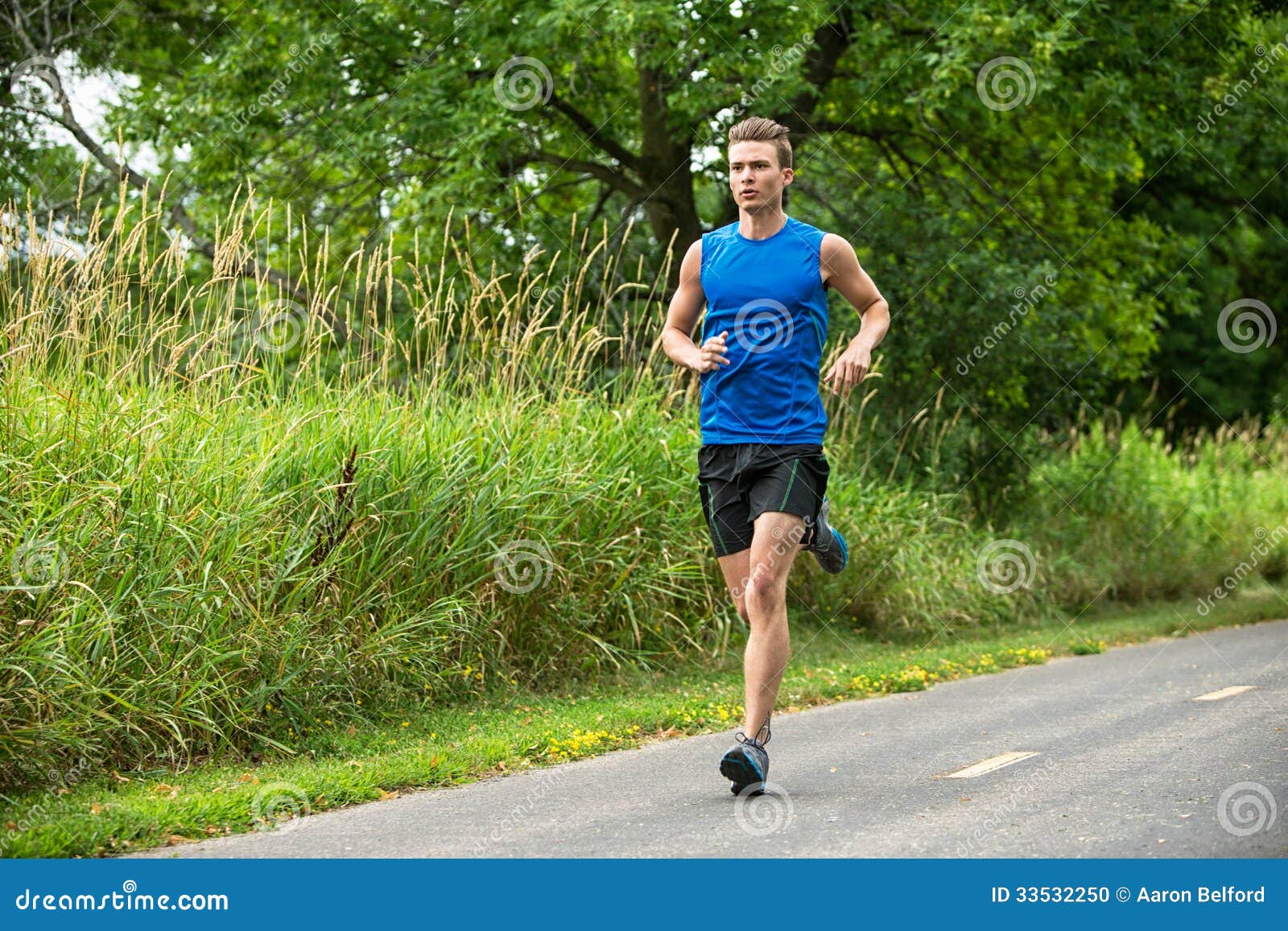 Young Man Jogging stock photo. Image of adult, green - 33532250