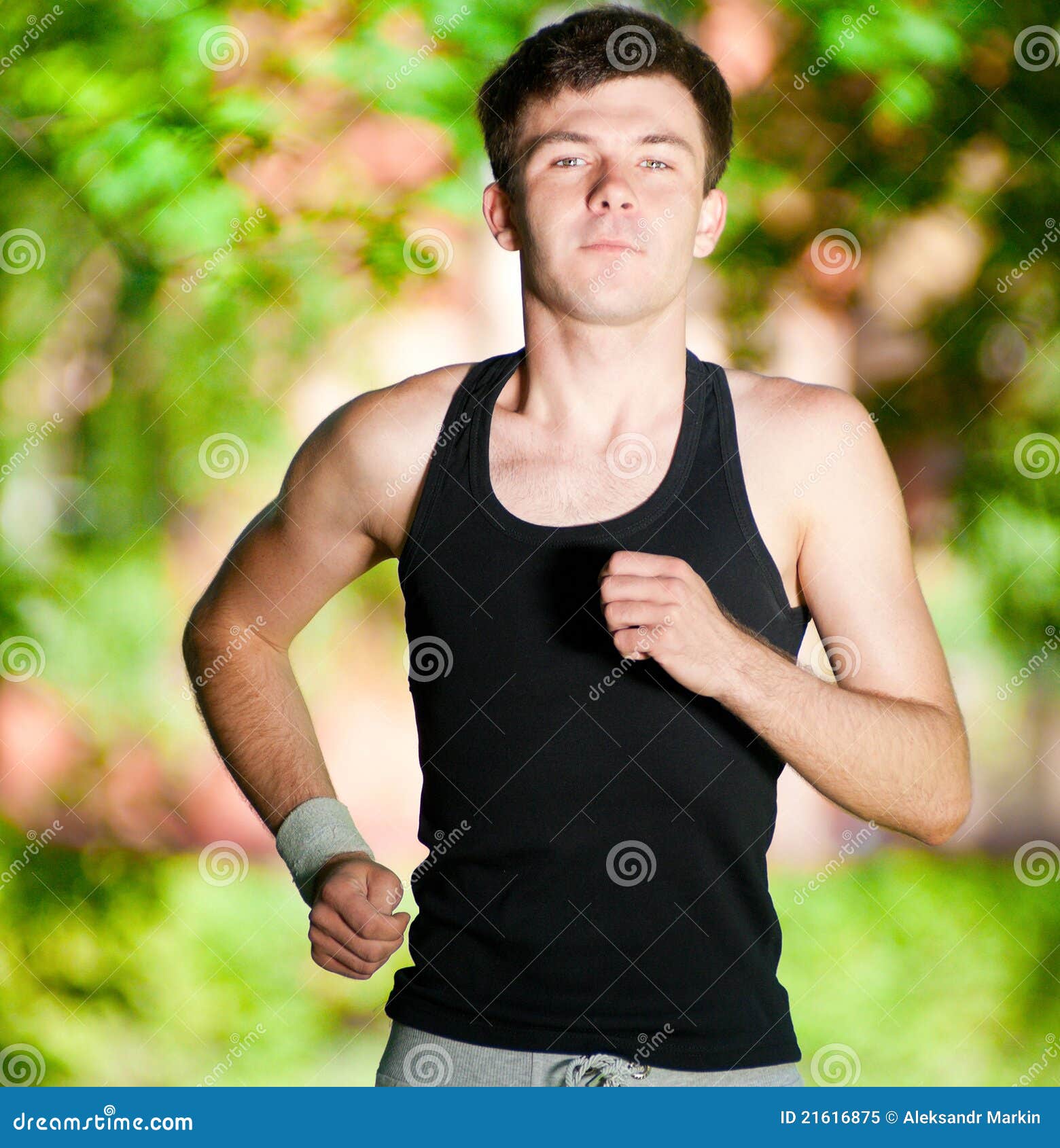 Young man jogging in park stock image. Image of happy - 21616875