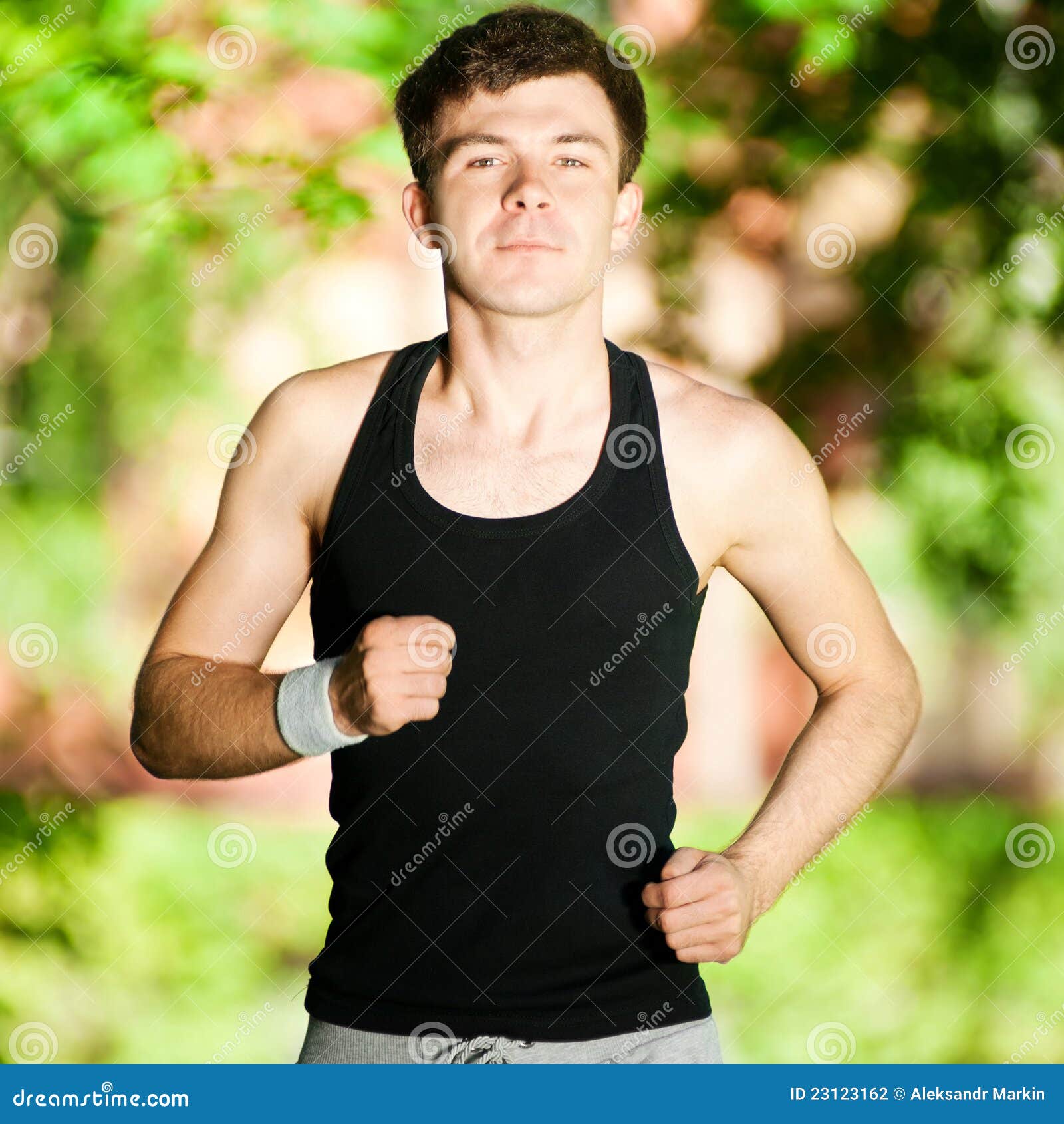 Young man jogging in park stock photo. Image of exercise - 23123162