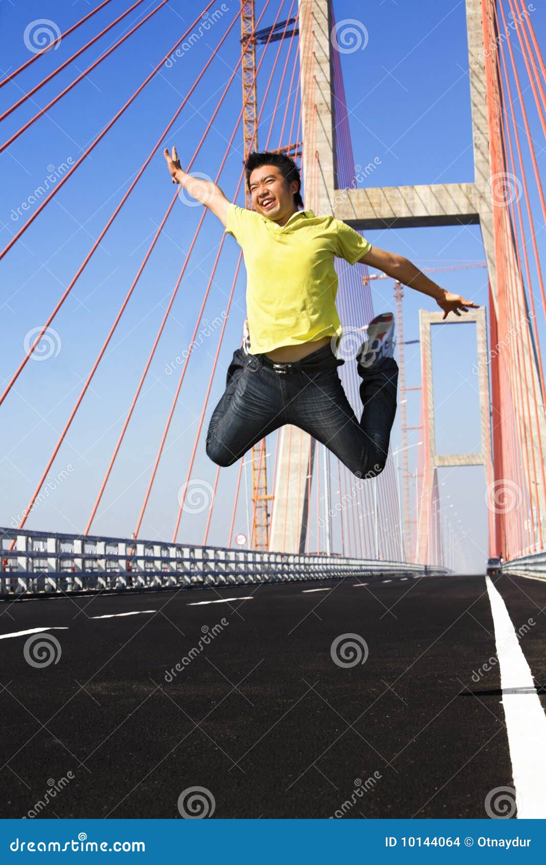 Young Man Jump Very High in Bridge Area Stock Photo - Image of road ...