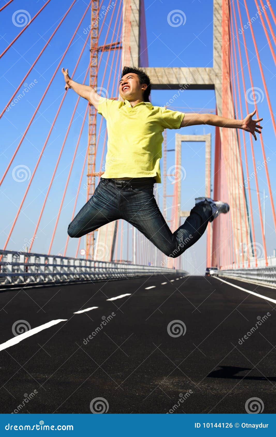 Young Man Jump Very High in Bridge Area Stock Photo - Image of ...