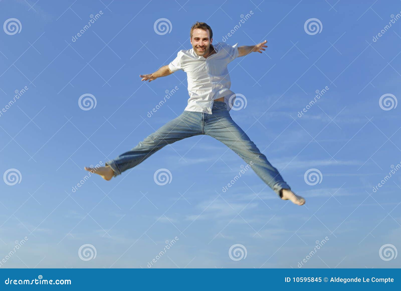 Young Man Jumping in the Air Stock Image - Image of smile, caucasian ...