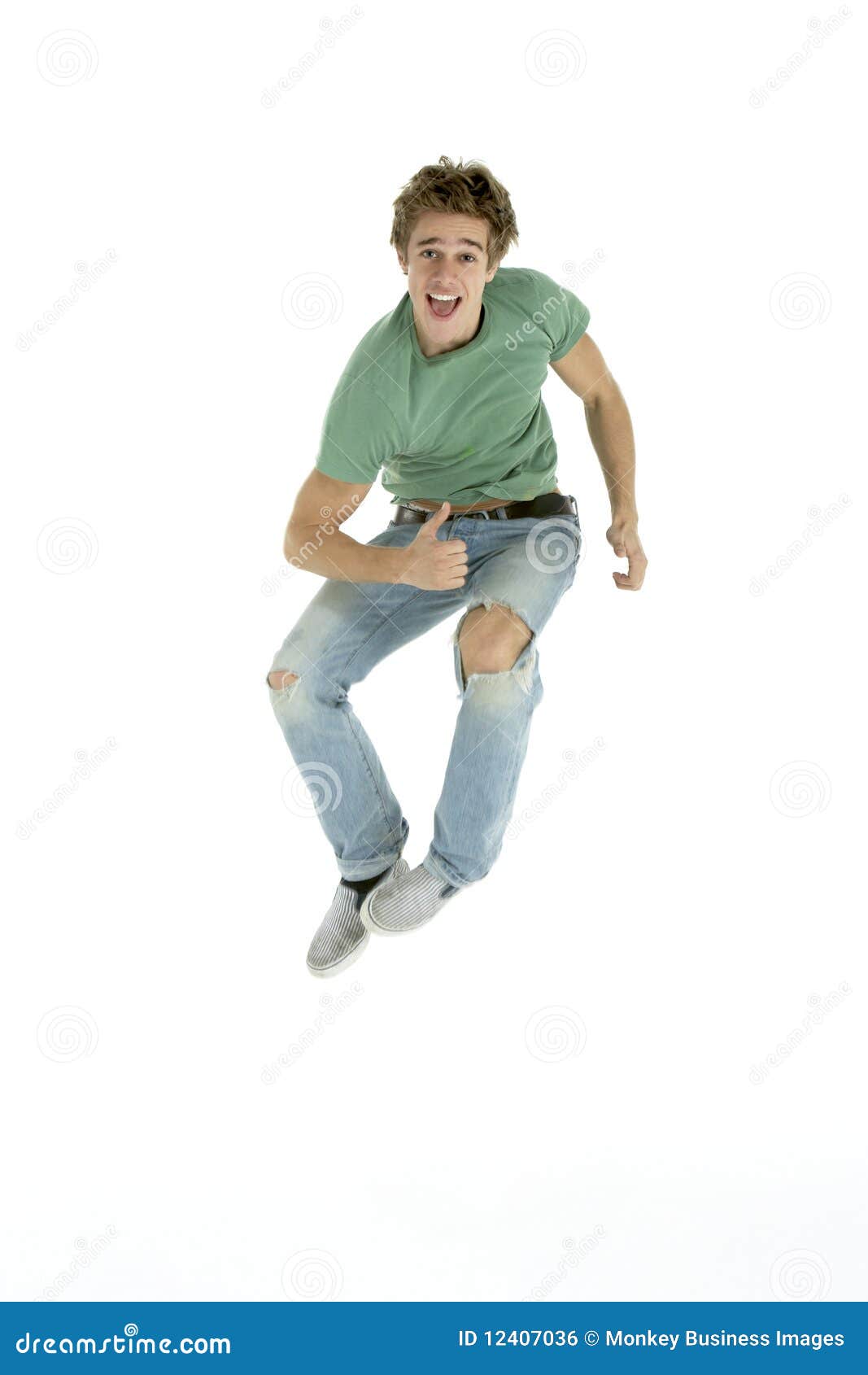 Young Man Jumping in Air stock photo. Image of youth - 12407036