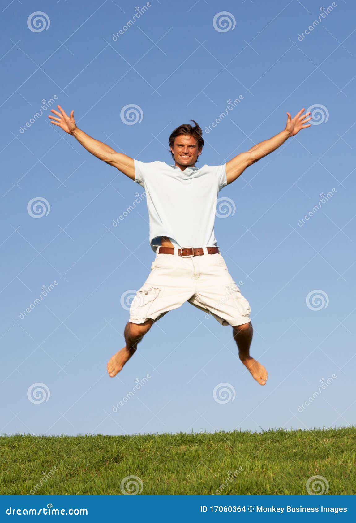 Young man jumping in air stock photo. Image of space - 17060364