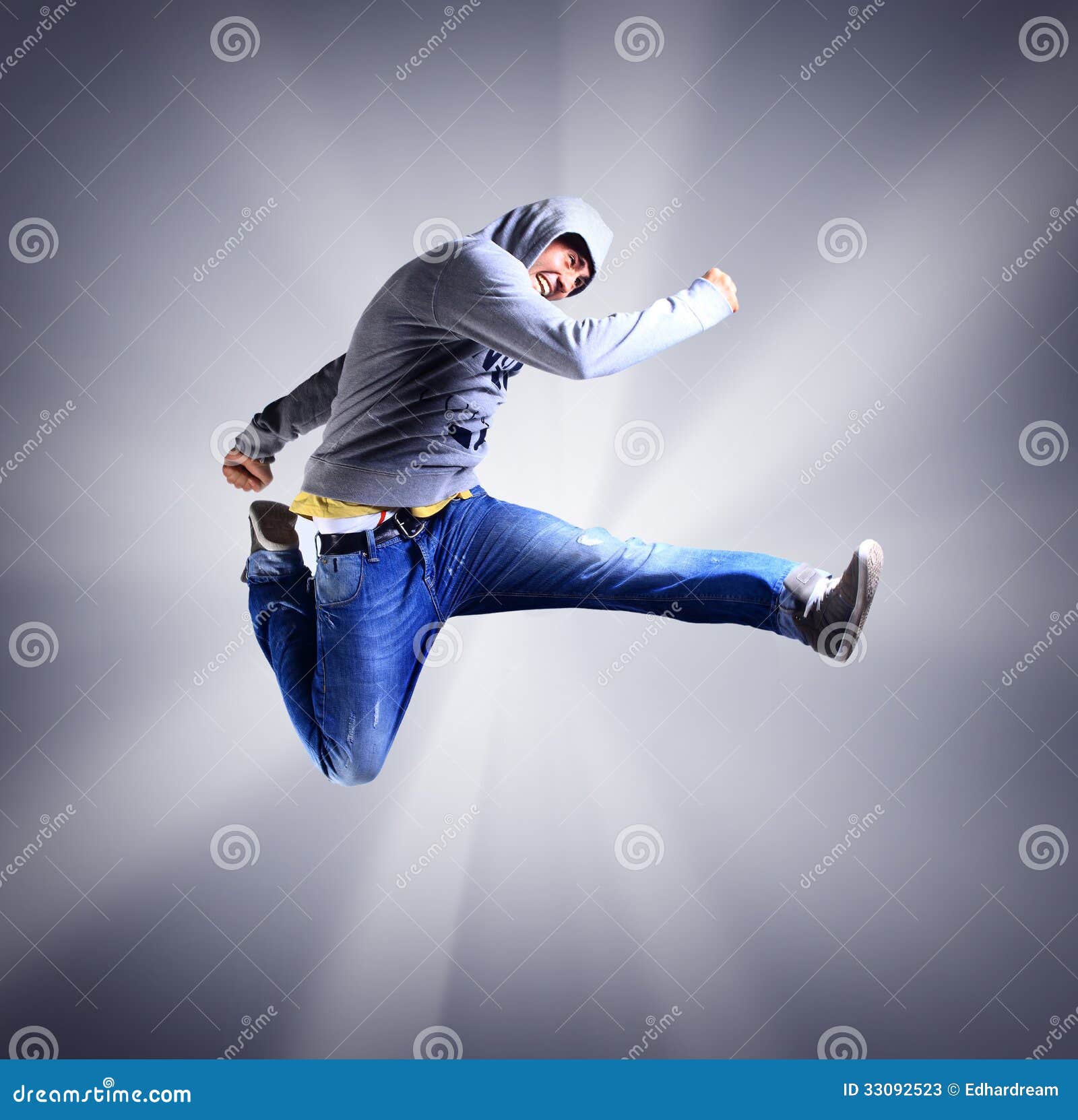 Young Man Jumping in Air Against Light Background Stock Image - Image ...