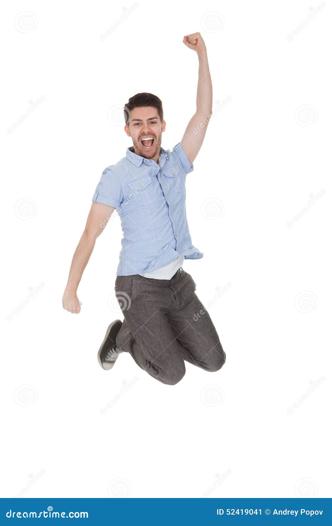 Young Man Jumping with Arms Raised Stock Image - Image of model ...