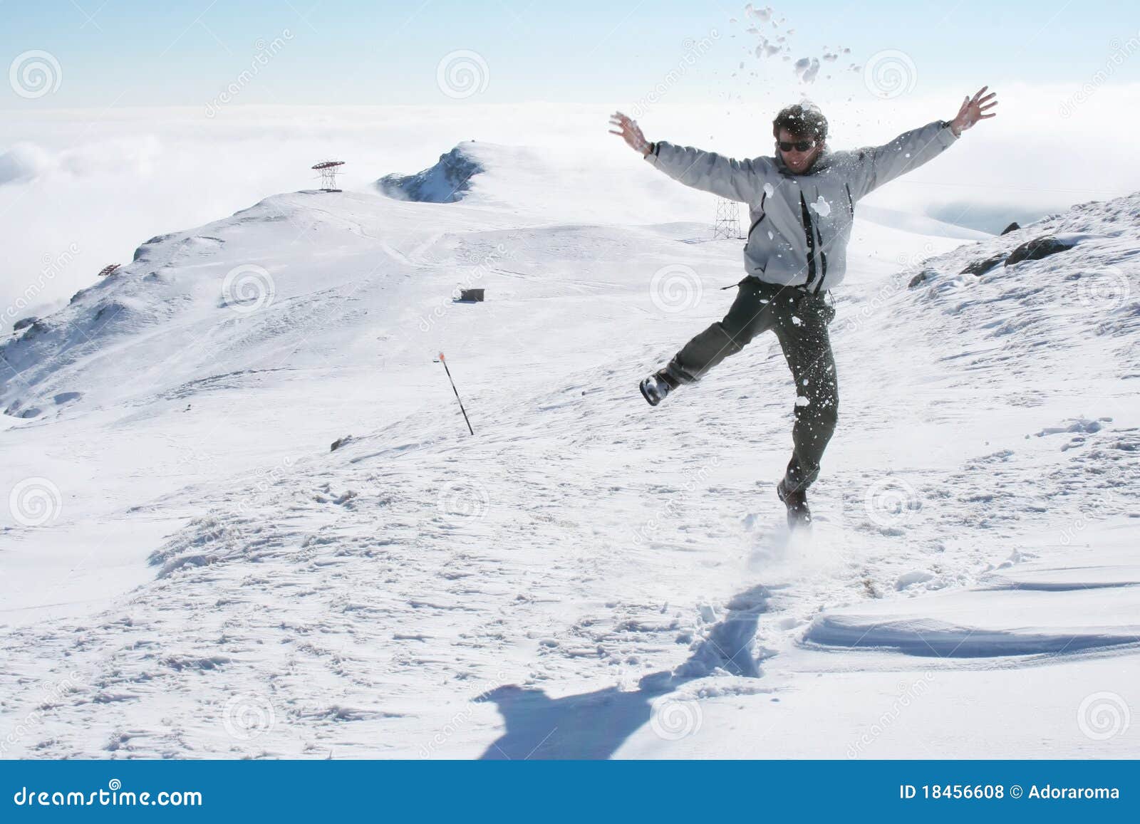 Young Man Jumping for Fun in the Snow Stock Photo - Image of winter ...