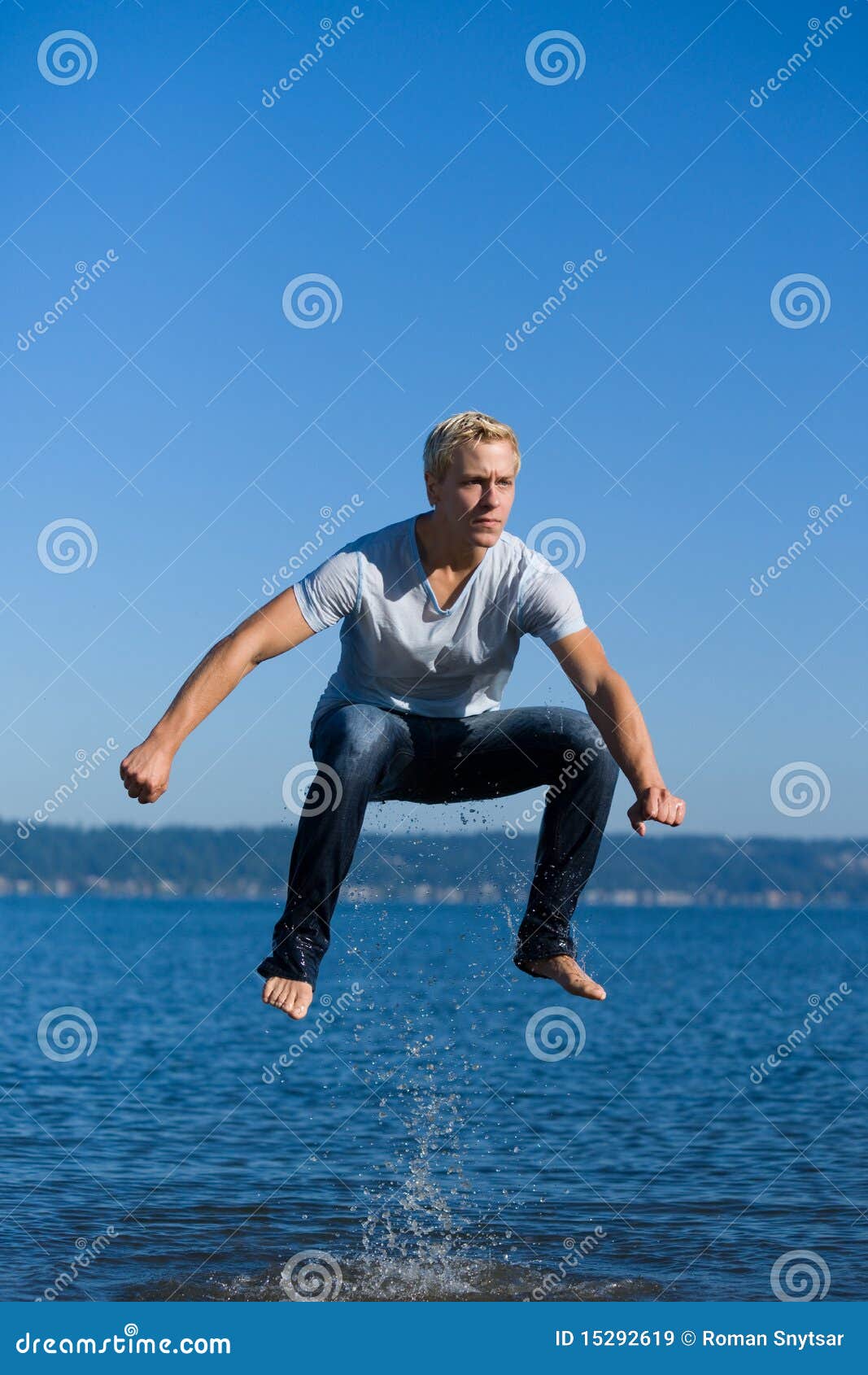Young Man Jumping Out of Water Stock Image - Image of happy, high: 15292619