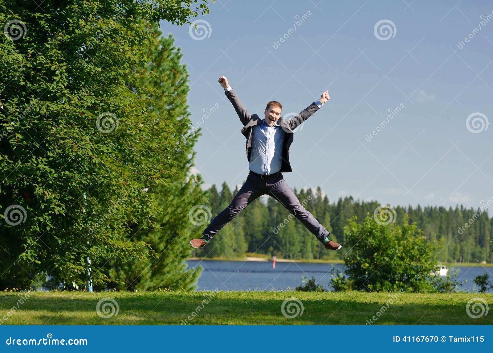 Young man jumping outside stock photo. Image of joyful - 41167670