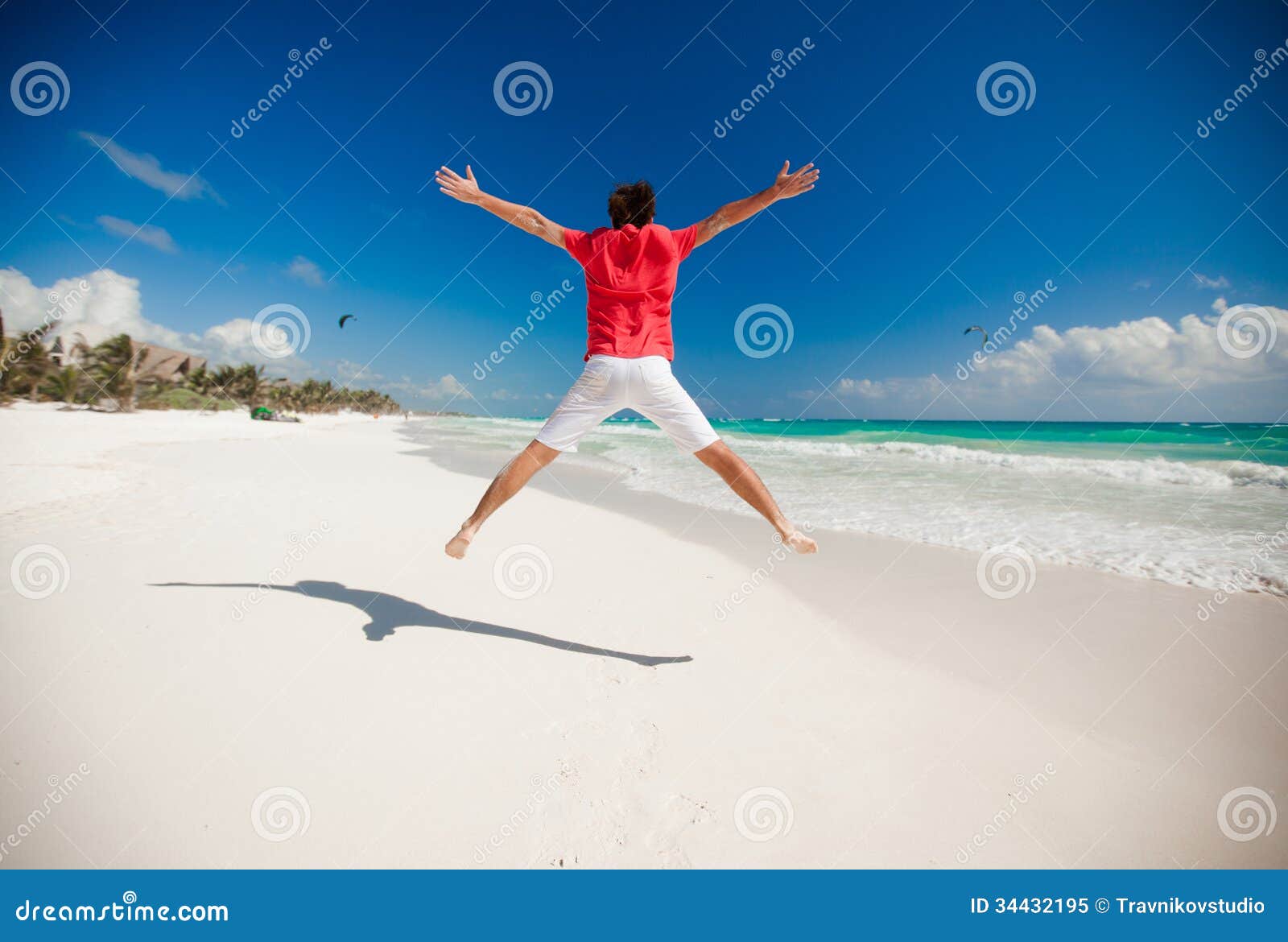 Young Man Jumping and Raising His Arms Up on the Stock Image - Image of ...
