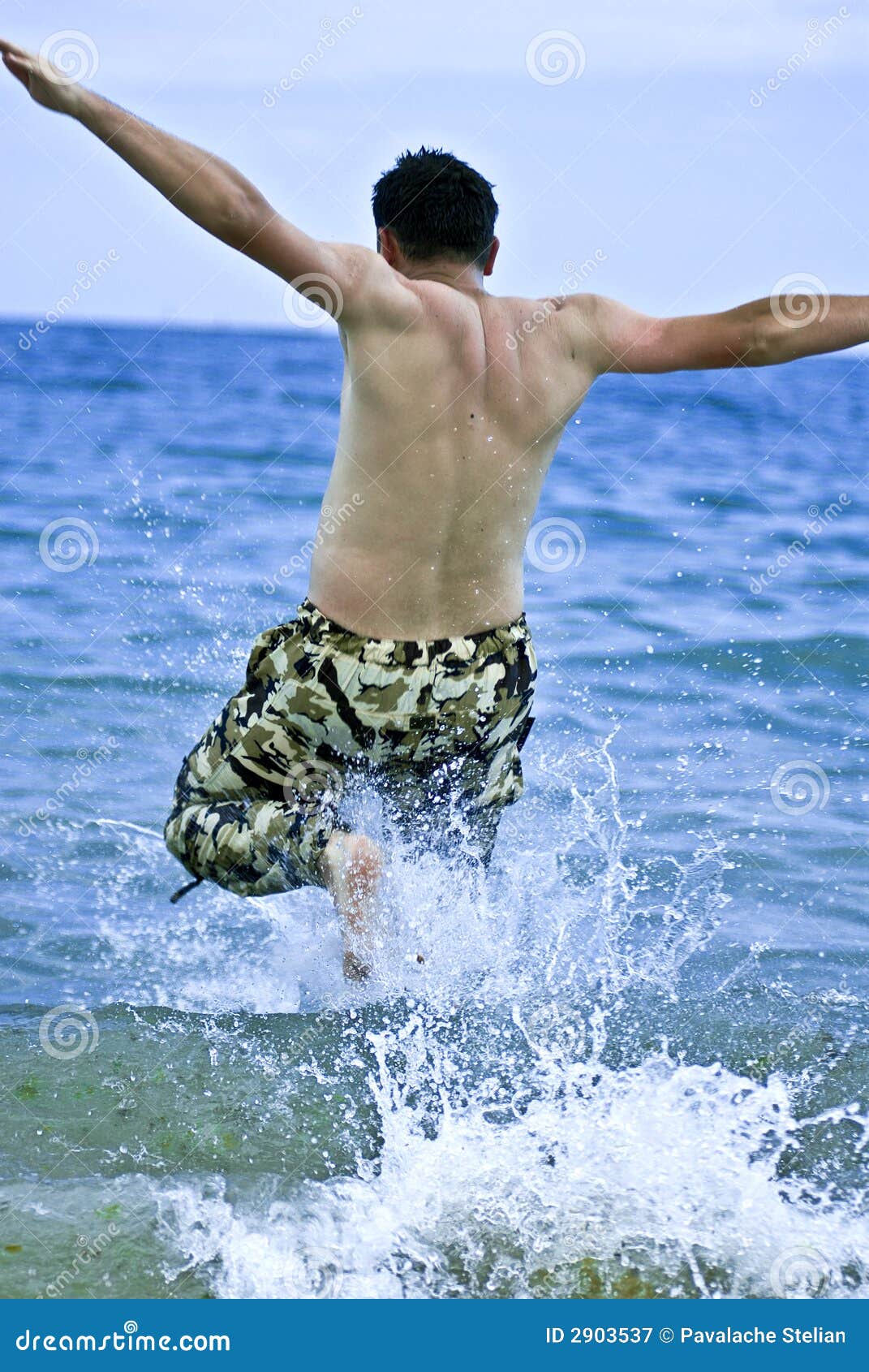 Young Man Jumping into Sea Water Stock Image - Image of swim, splash ...