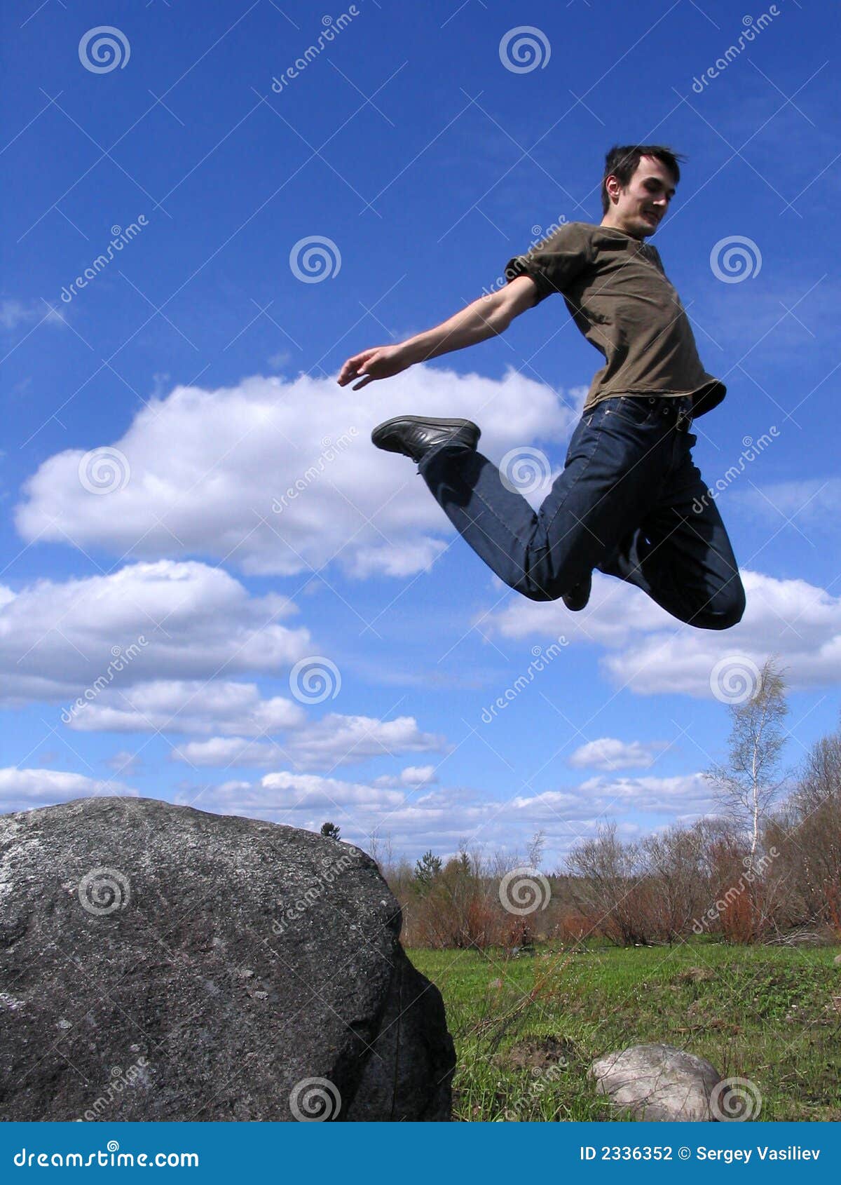 Young Man Jumping from Stone Stock Photo - Image of glad, health: 2336352