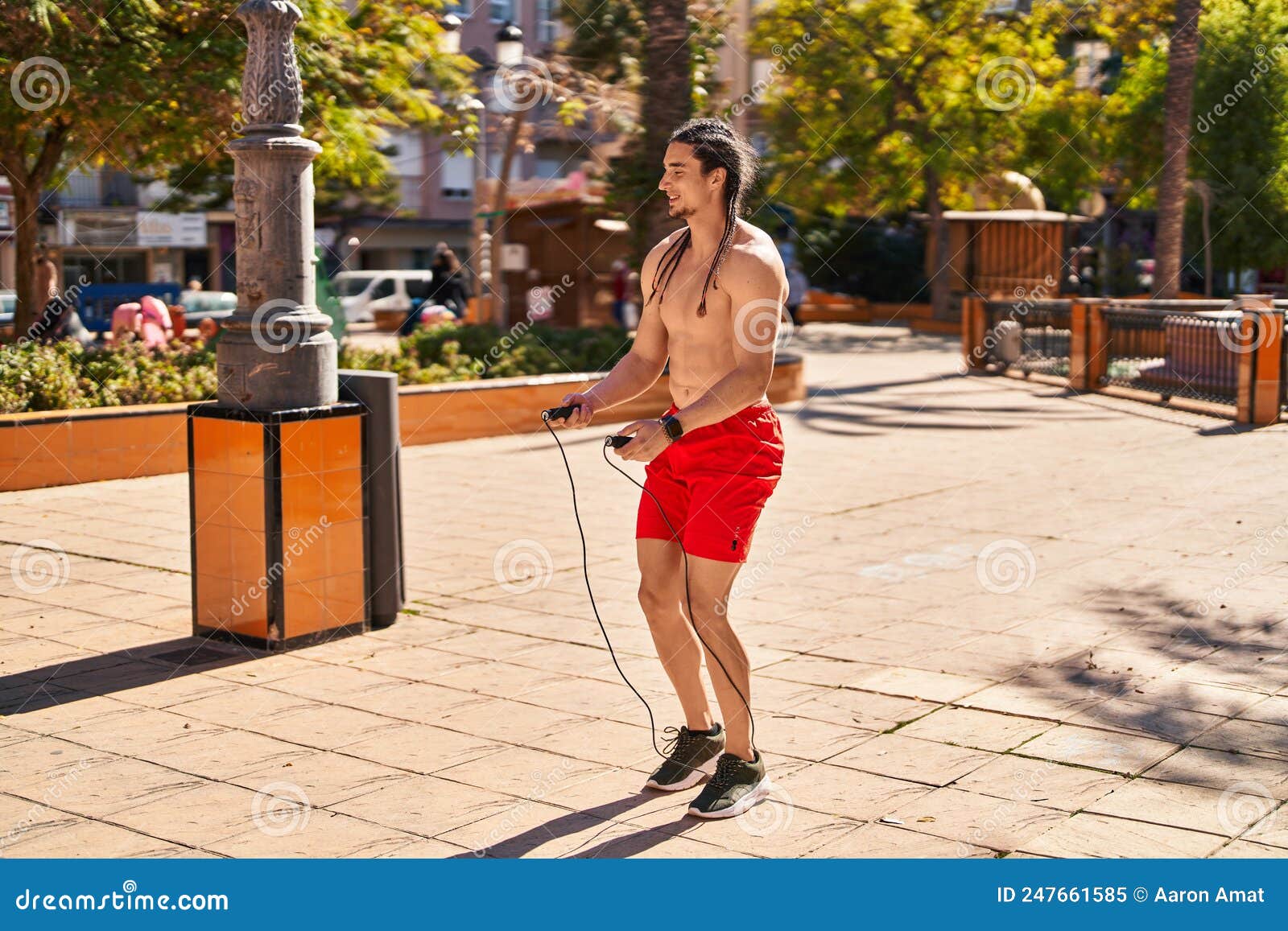 Young Man Jumping Using Rope at Park Stock Image - Image of braids ...