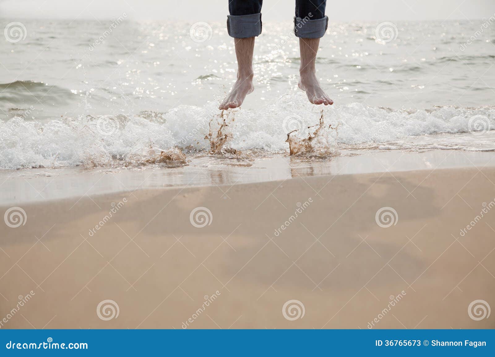 Young Man Jumping in the Waves Stock Image - Image of focus, splashing ...
