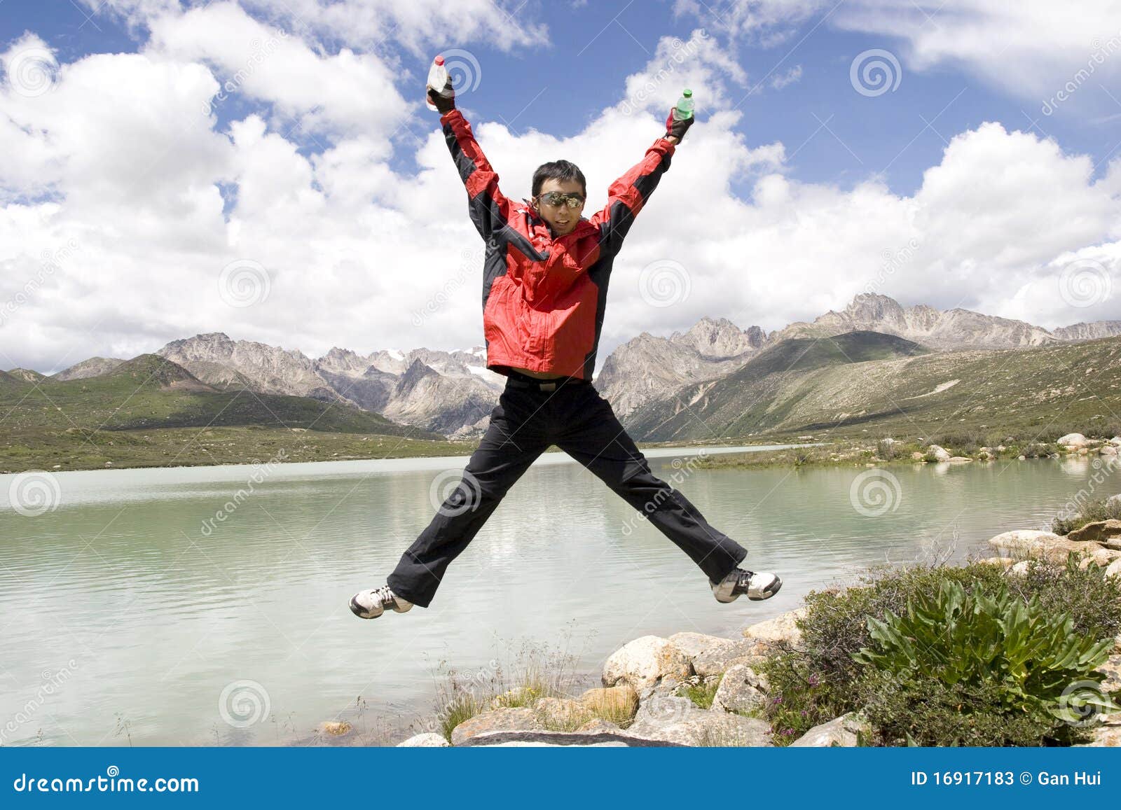 Young man jumps high stock image. Image of blue, cheerful - 16917183