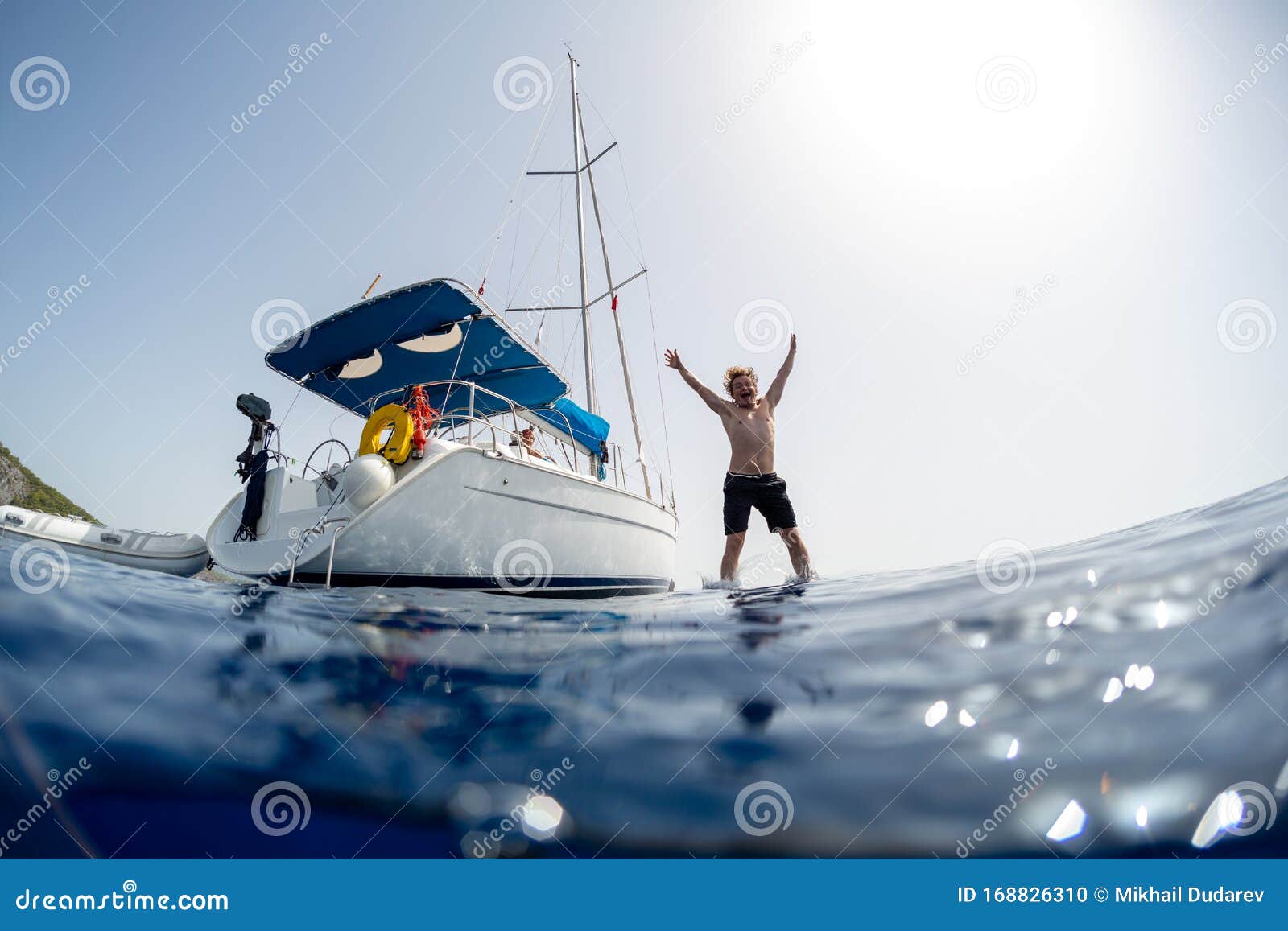 Young Man Jumps into the Sea Stock Photo - Image of sunny, jump: 168826310