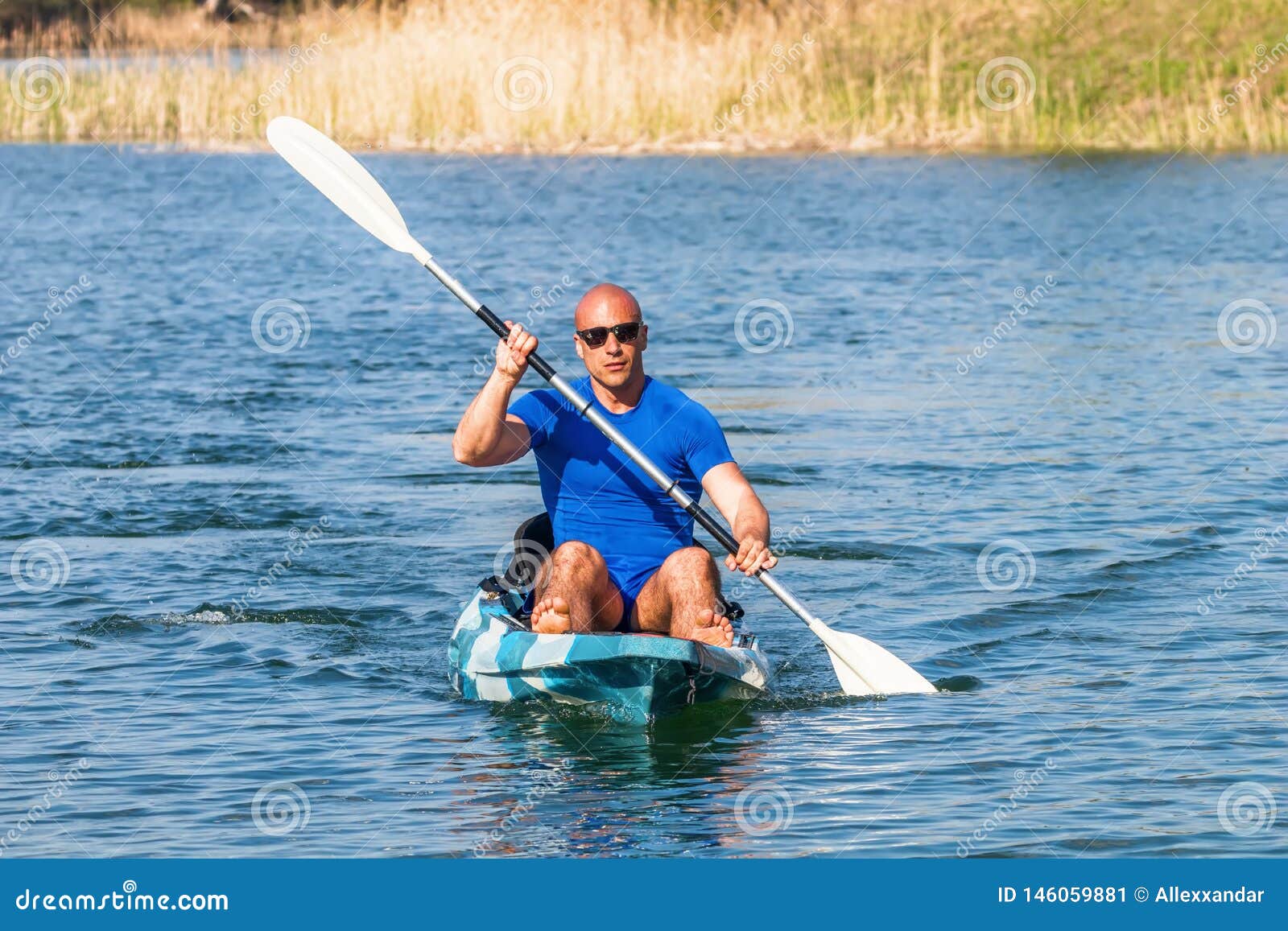 Young Man Kayaking on Lake. Lake Kayaking Stock Image - Image of ...