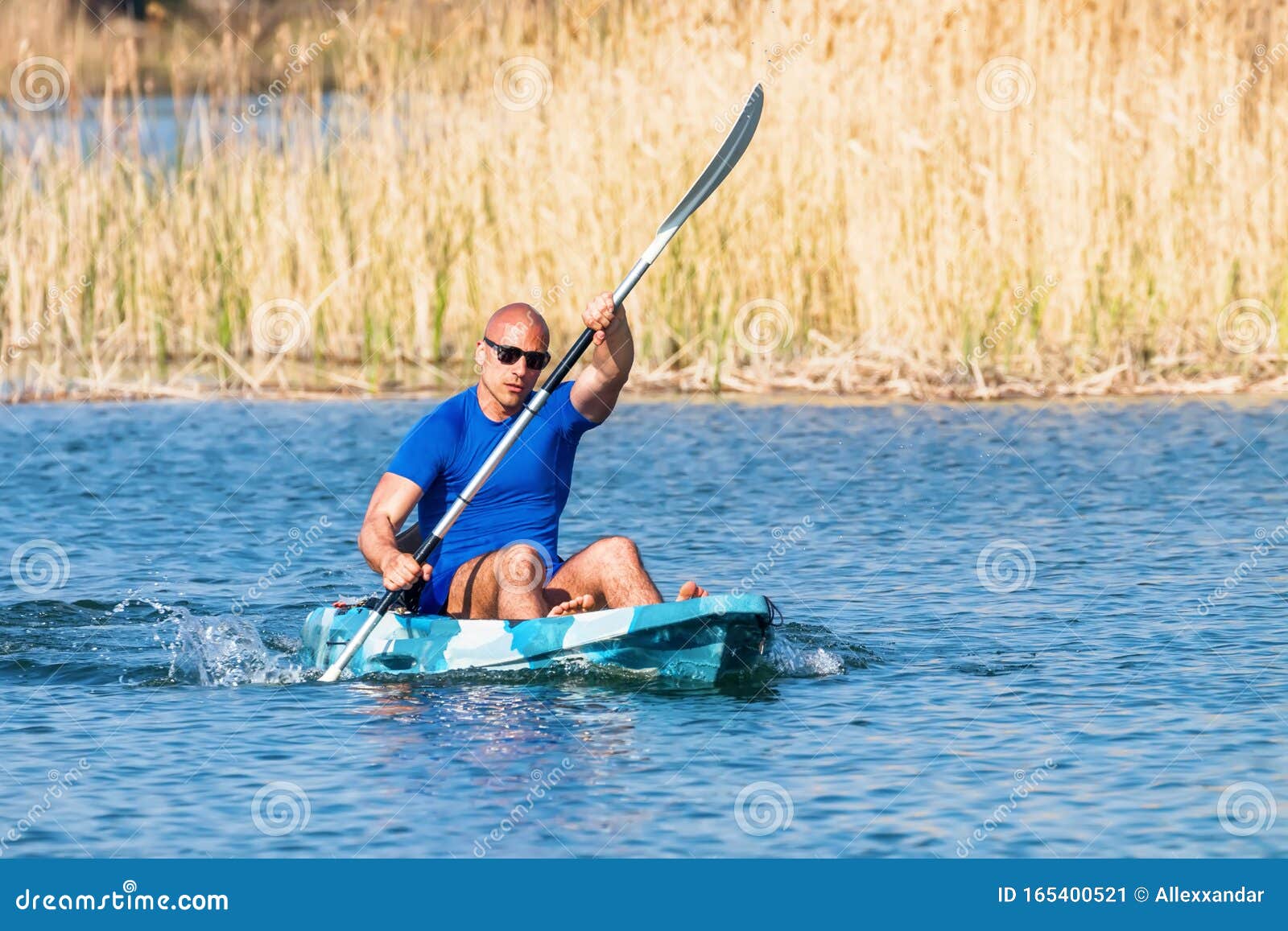 Young Man Kayaking on Lake. Lake Kayaking Stock Image - Image of ...