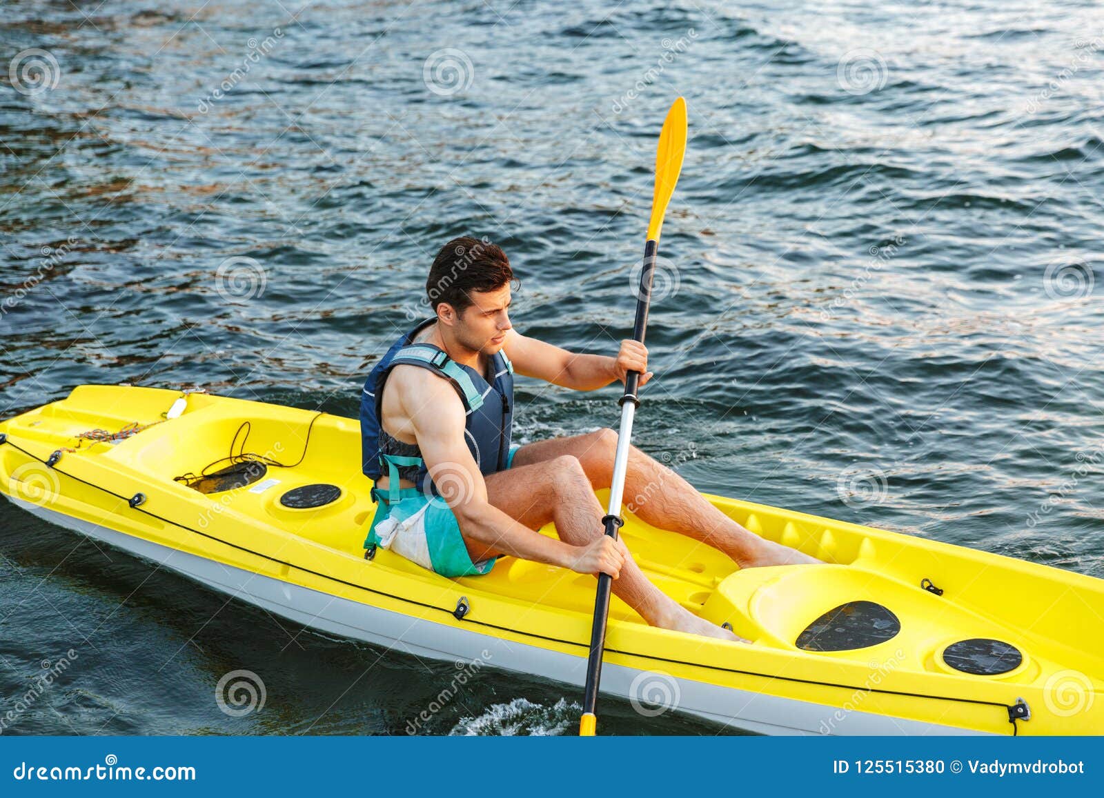 Young Man Kayaking on a Lake Stock Photo - Image of sport, casual ...