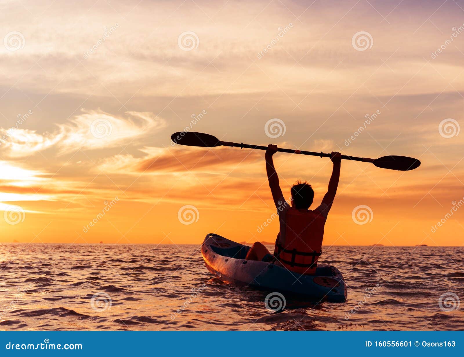 Young Man Kayaking on the Sea at Sunset Stock Image - Image of beach ...