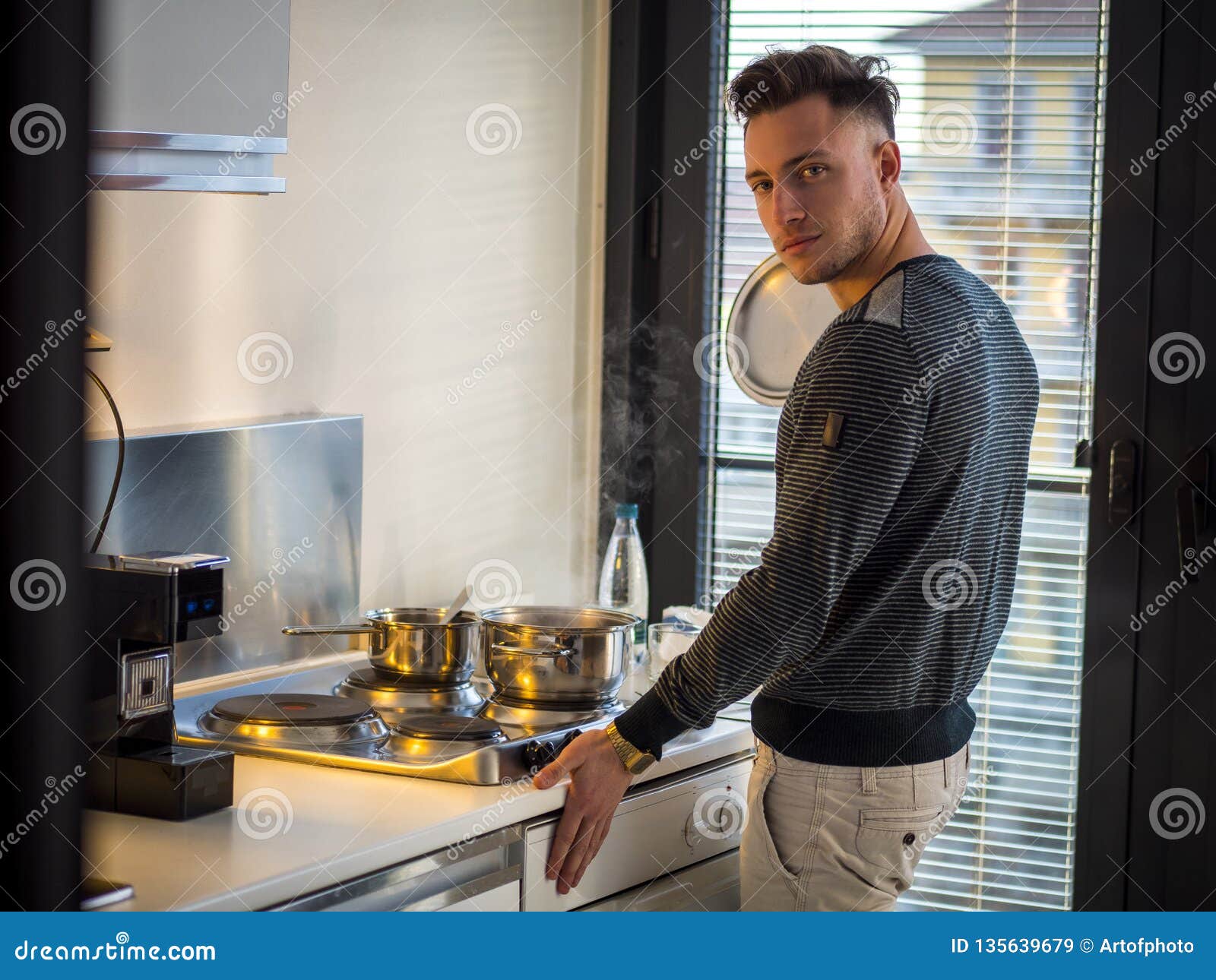 Young Man in Kitchen at Home, Cooking at the Stove Stock Image - Image ...
