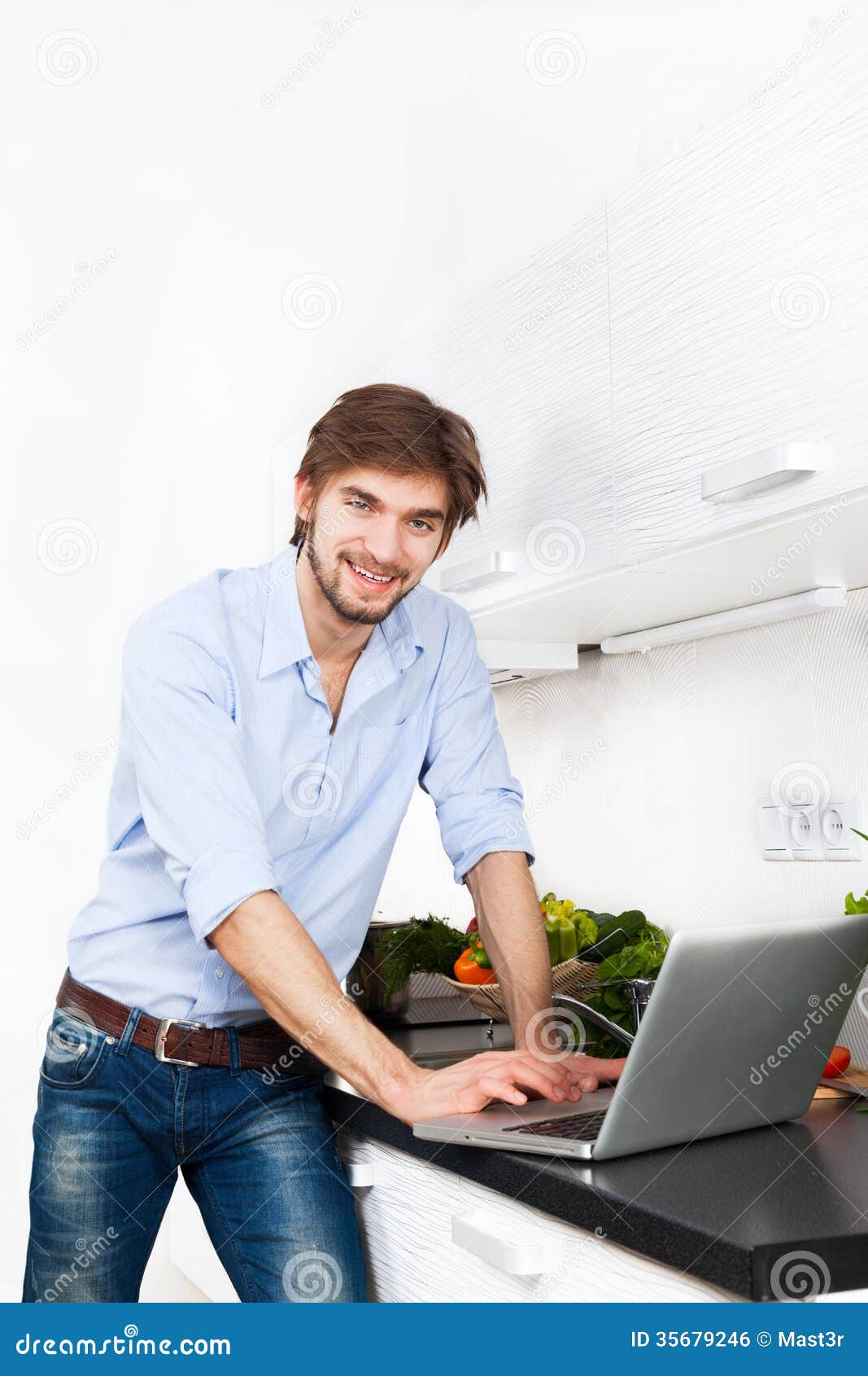 Young man kitchen stock photo. Image of laptop, kitchen - 35679246
