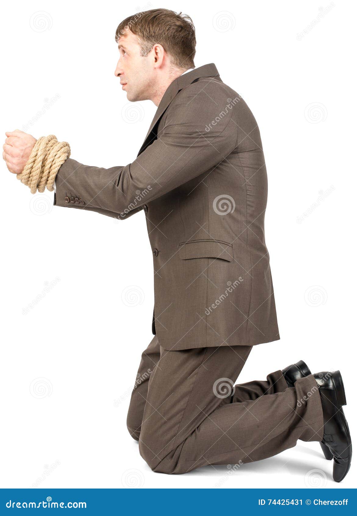 Young man kneeling stock image. Image of shirt, young - 74425431