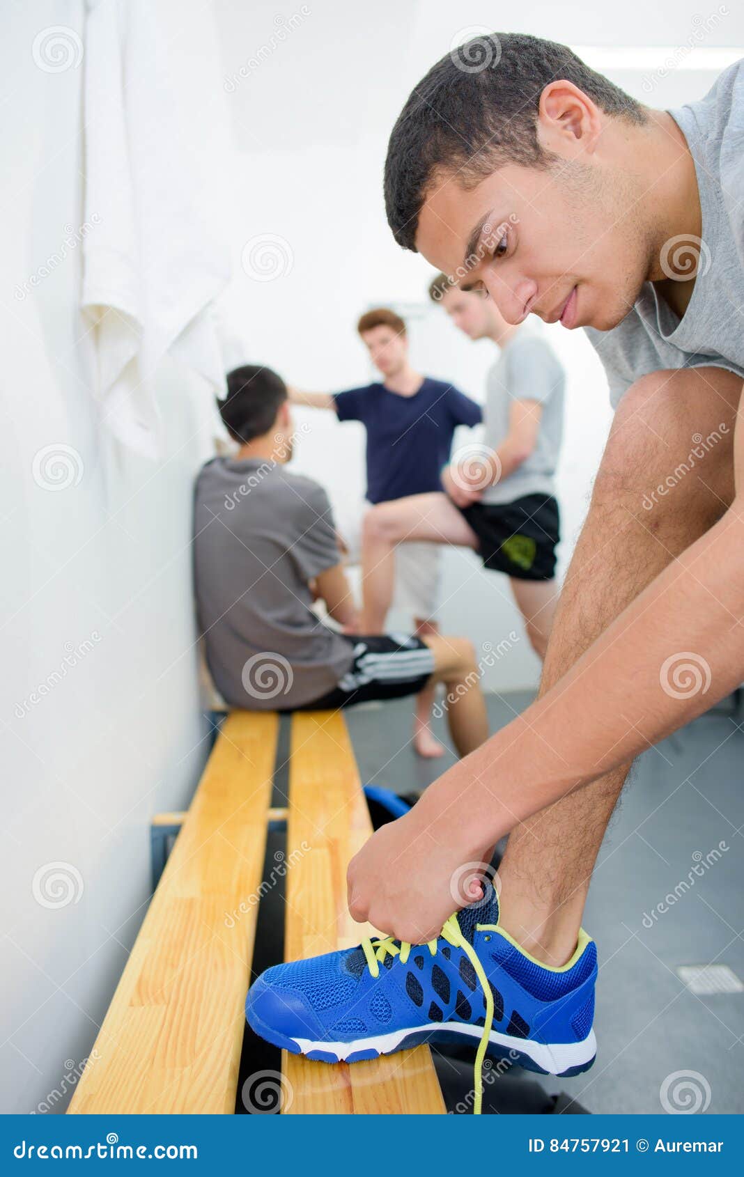 Young Man Lacing Up Trainer Stock Image - Image of smile, fitness: 84757921