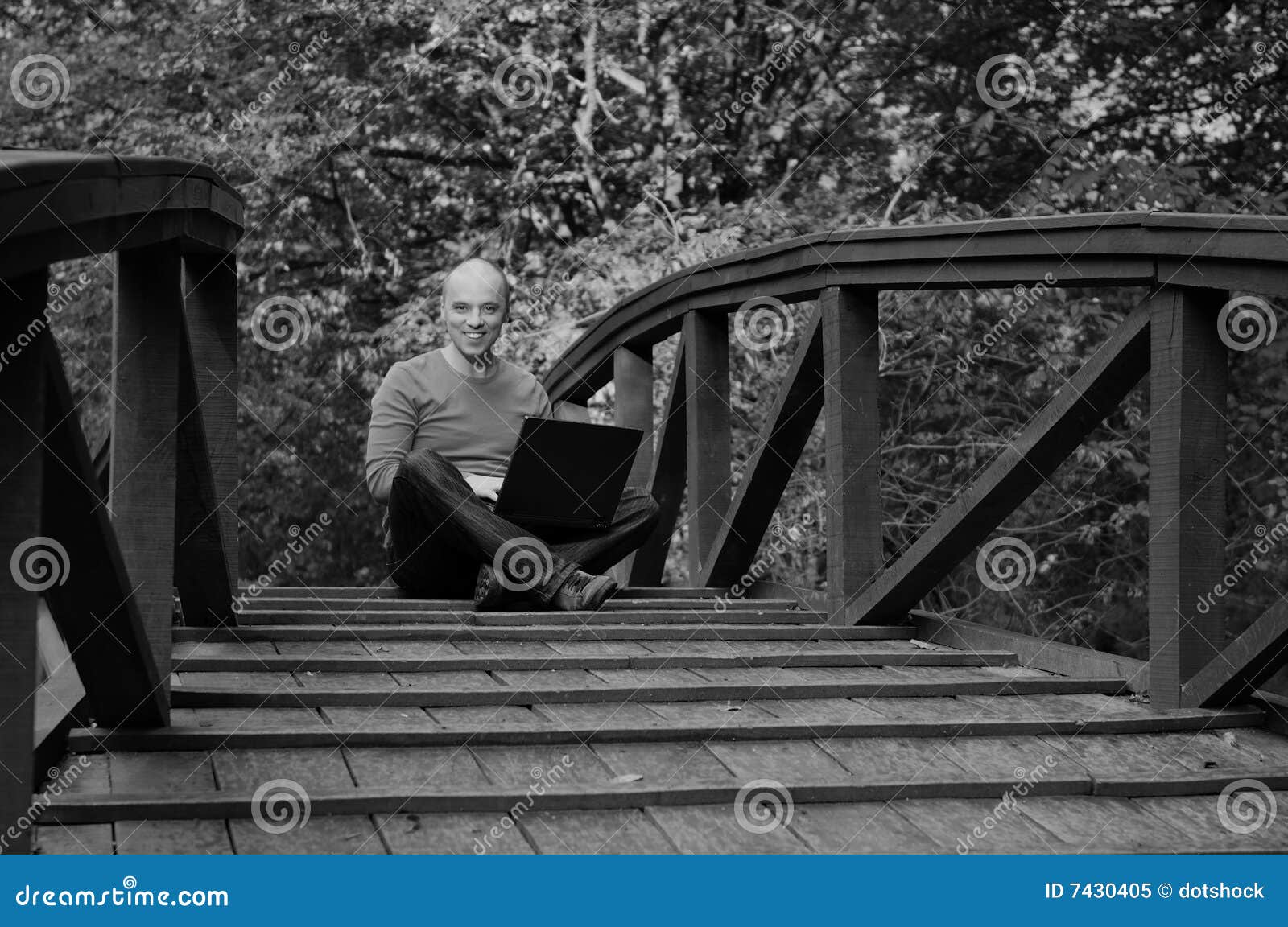 Young Man with Laptop at Bridge Stock Image - Image of male, alone: 7430405