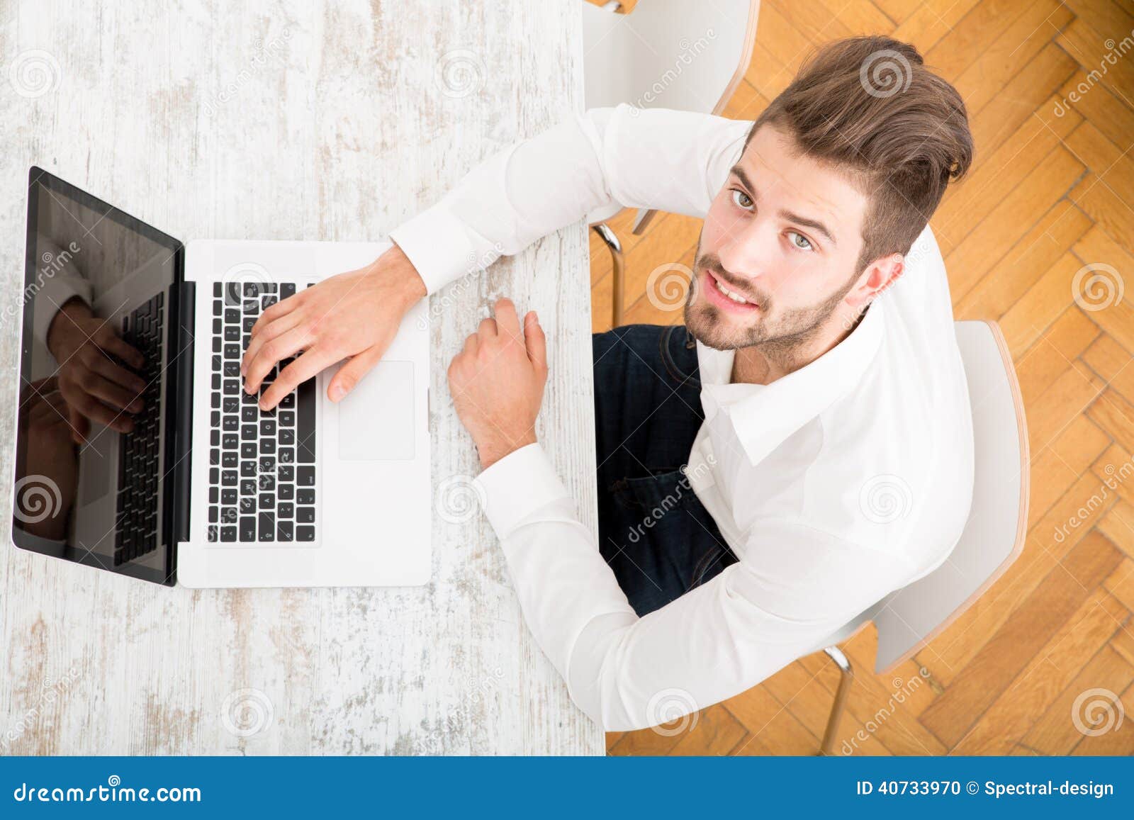 Young Man with a Laptop Computer Stock Photo - Image of desk ...