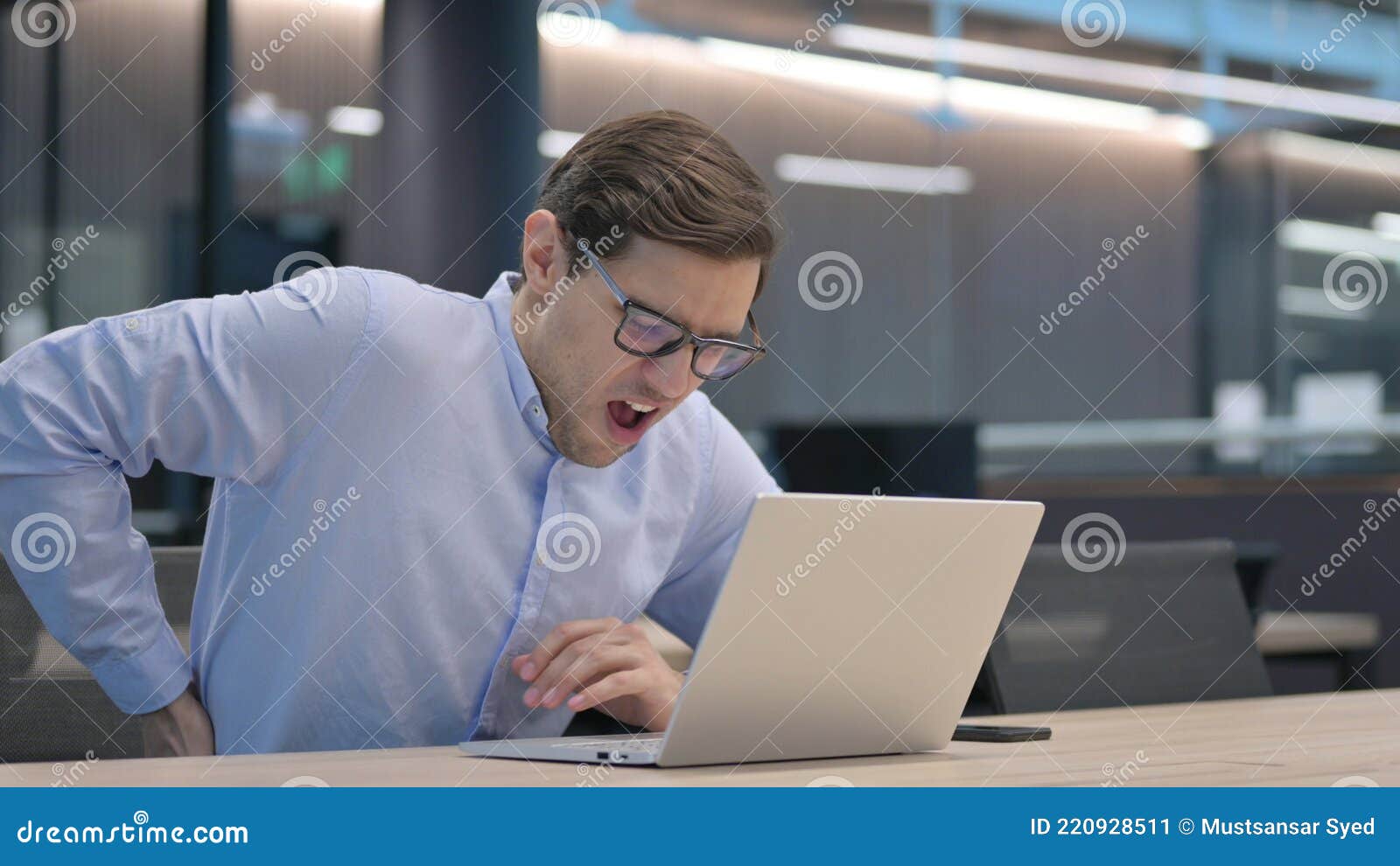 Young Man with Laptop Having Back Pain Stock Image - Image of spine ...