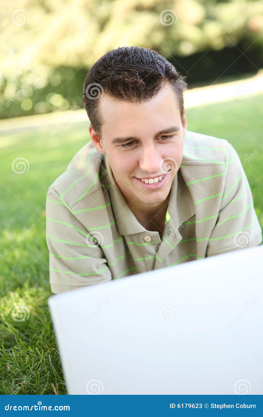 Young Man on Laptop in Park Stock Image - Image of meadow, business ...