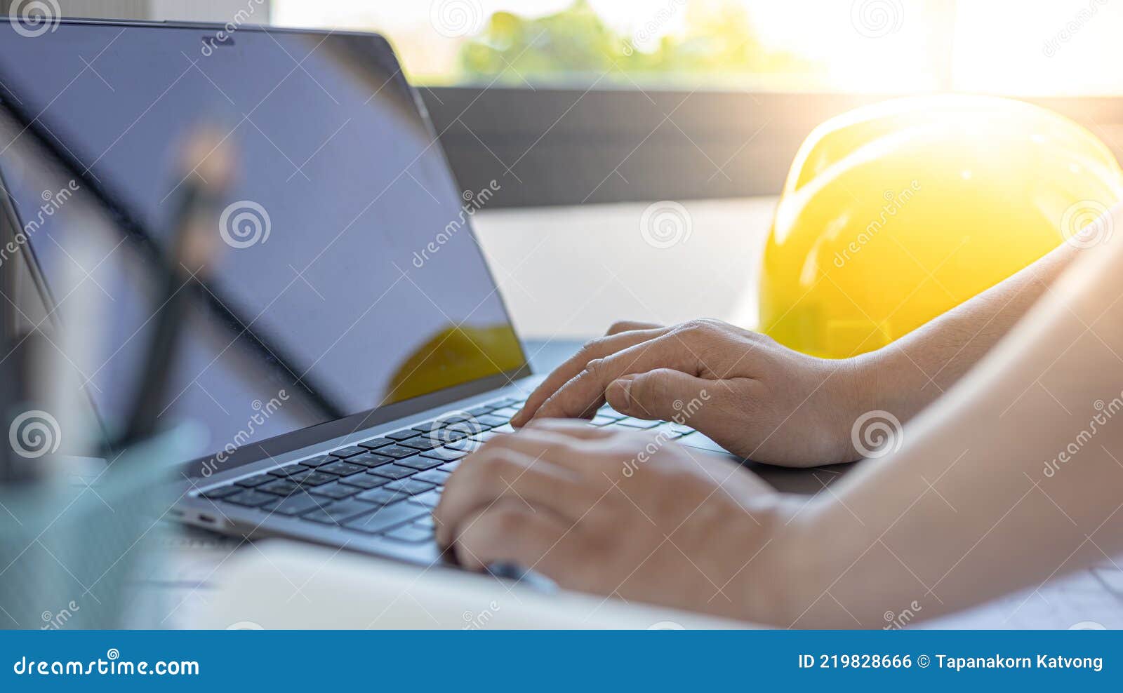Young Man with a Laptop Plotting a System of Building Structures in ...