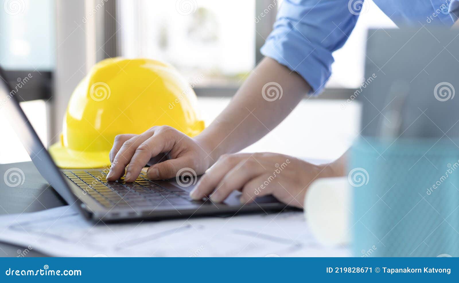 Young Man with a Laptop Plotting a System of Building Structures in ...