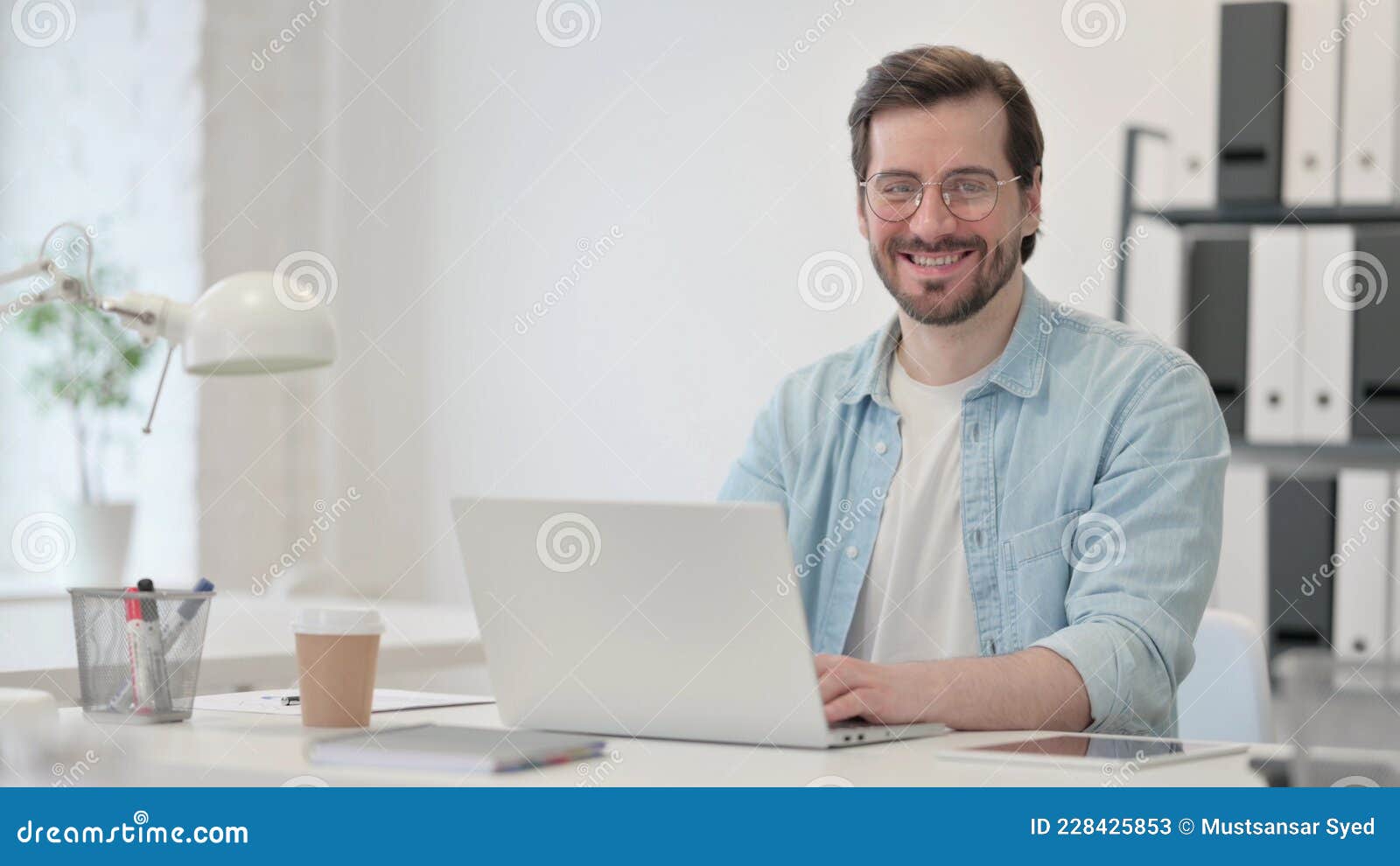 Young Man with Laptop Smiling at Camera Stock Image - Image of ...