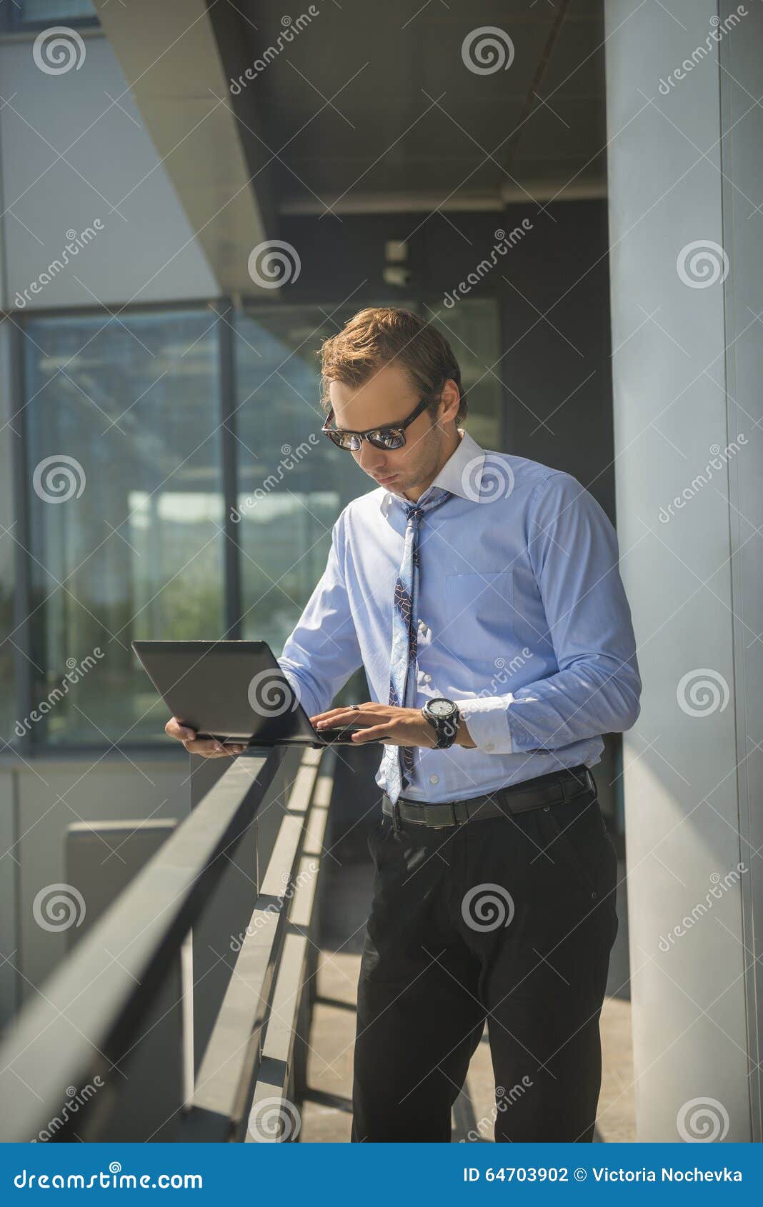 Young man with laptop stock photo. Image of orders, calculations - 64703902