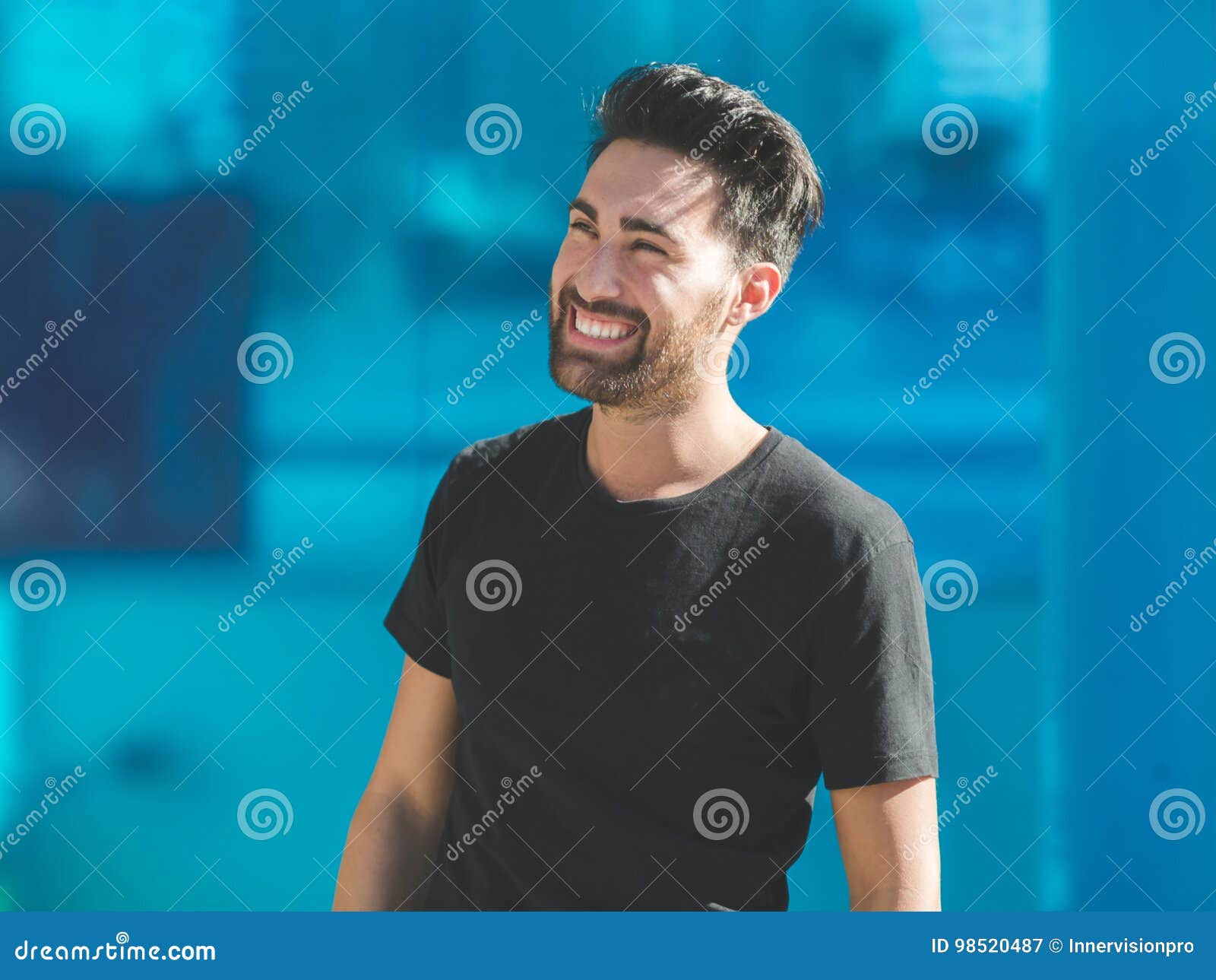 Young Man Laughing on Blue Background Stock Image - Image of enjoy ...