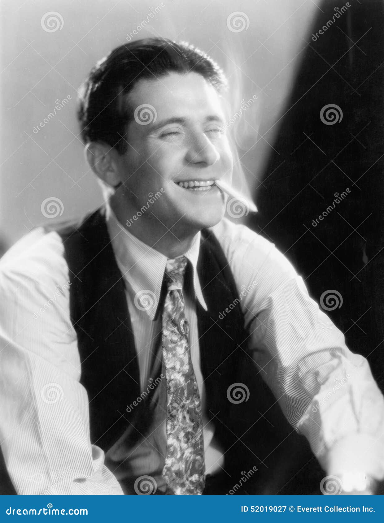 Young Man Laughing and Smoking a Cigarette Stock Image - Image of ...