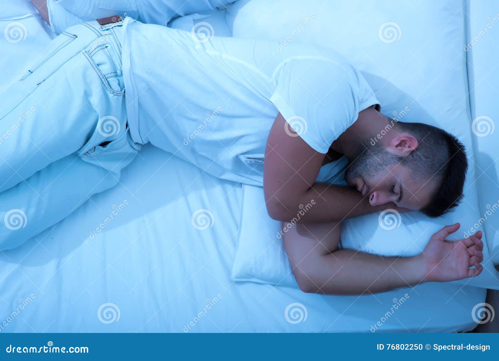 Young Man Laying in Bed at Night Stock Photo - Image of lying, rest ...