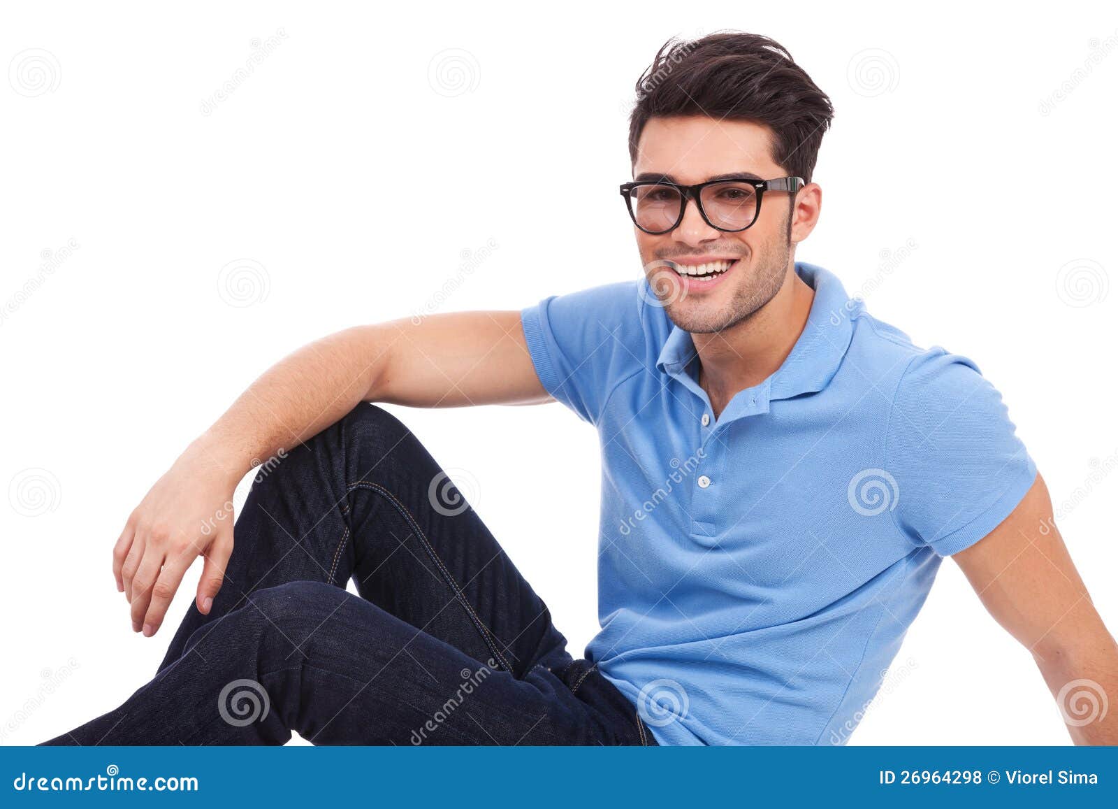 Young Man Laying on Floor and Smiling Stock Photo - Image of glasses ...