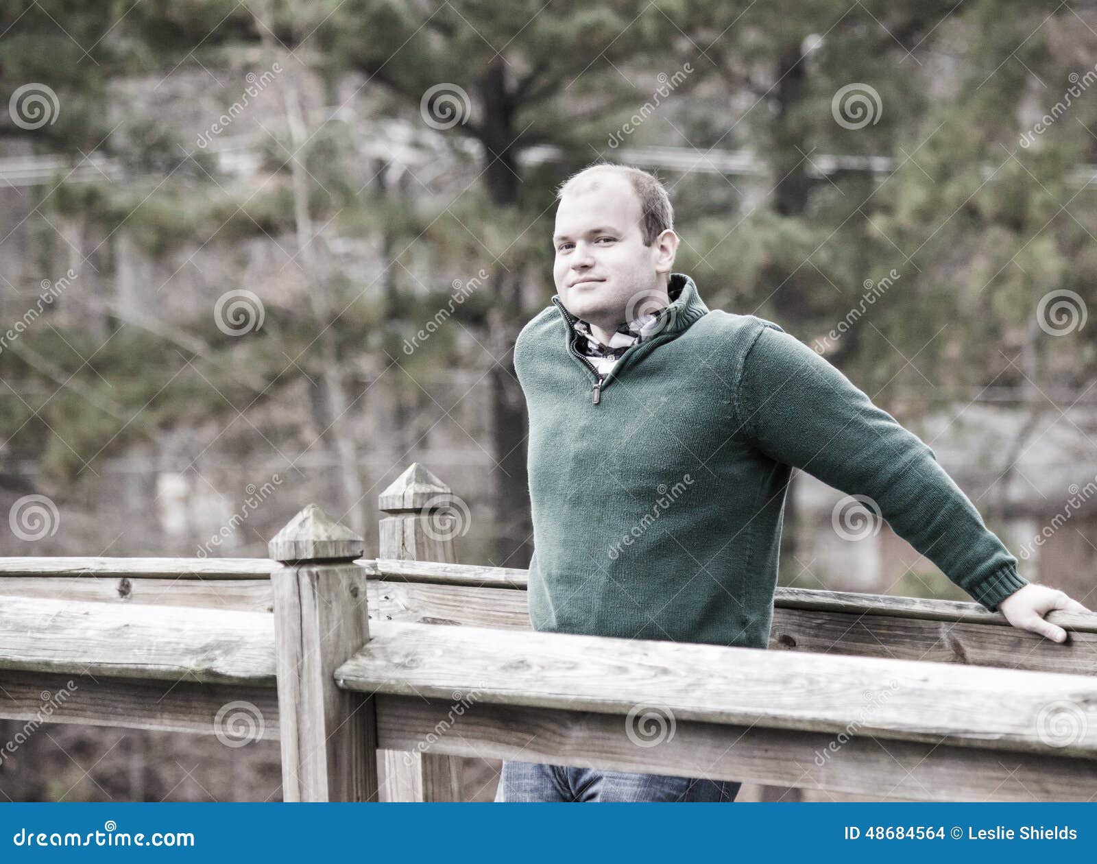 Young Man Leaning Against Bridge Rail Stock Photo - Image of confidence ...