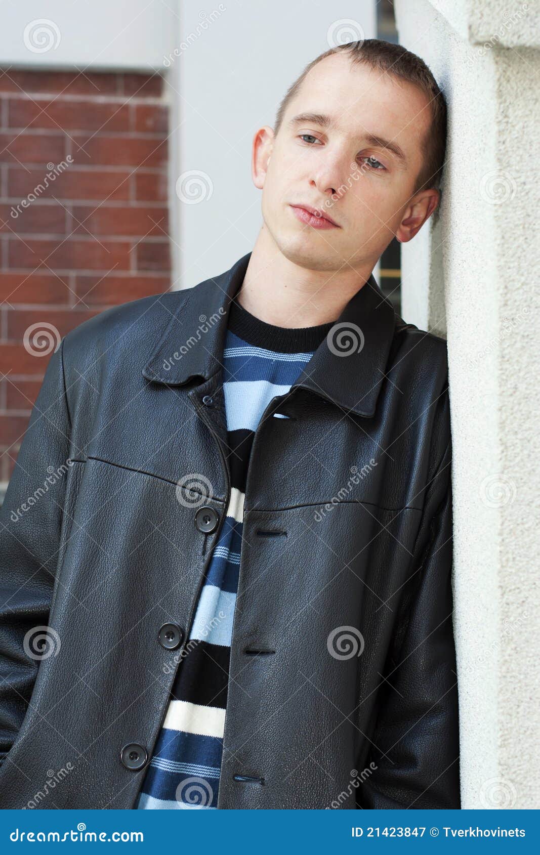 Young Man Leaning Against Wall Stock Image - Image of despondence ...