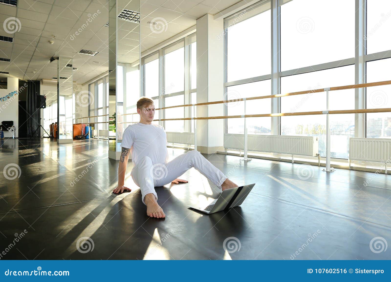 Young Man Learning New Dancing Technique with Laptop Tutorial. Stock ...