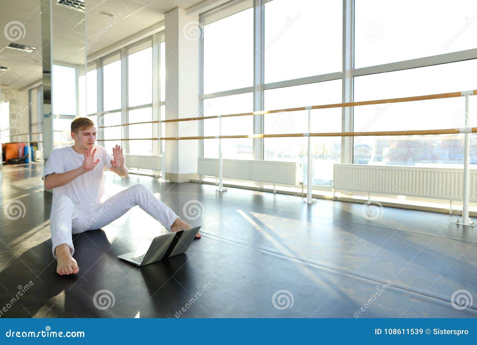 Young Man Learning New Dancing Technique with Laptop Tutorial. Stock ...