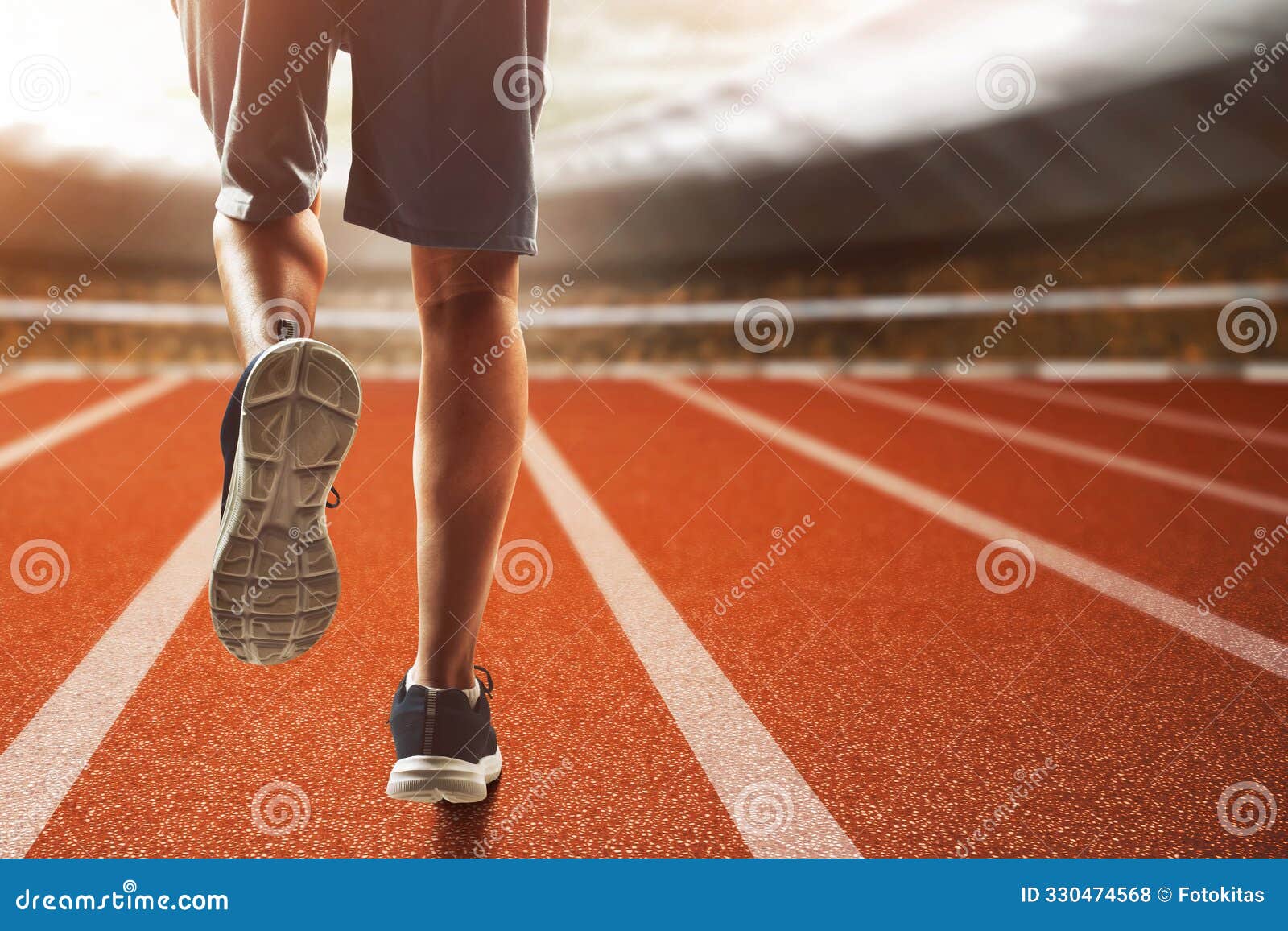Young Man Legs Running on Stadium Field with Red Asphalt Stock Photo ...