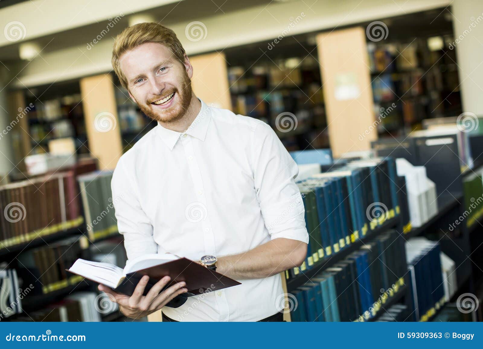 Young man in the library stock image. Image of young - 59309363