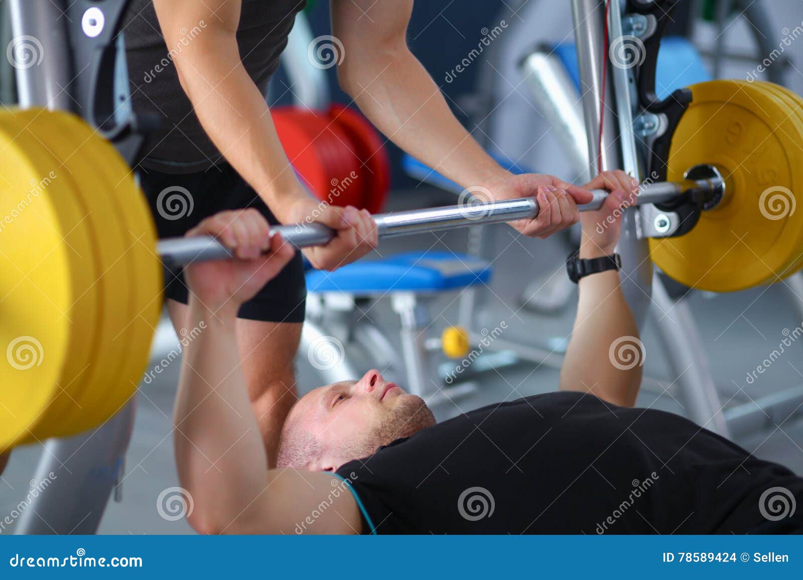 Young Man Lifting the Barbell in Gym with Instructor Stock Photo ...