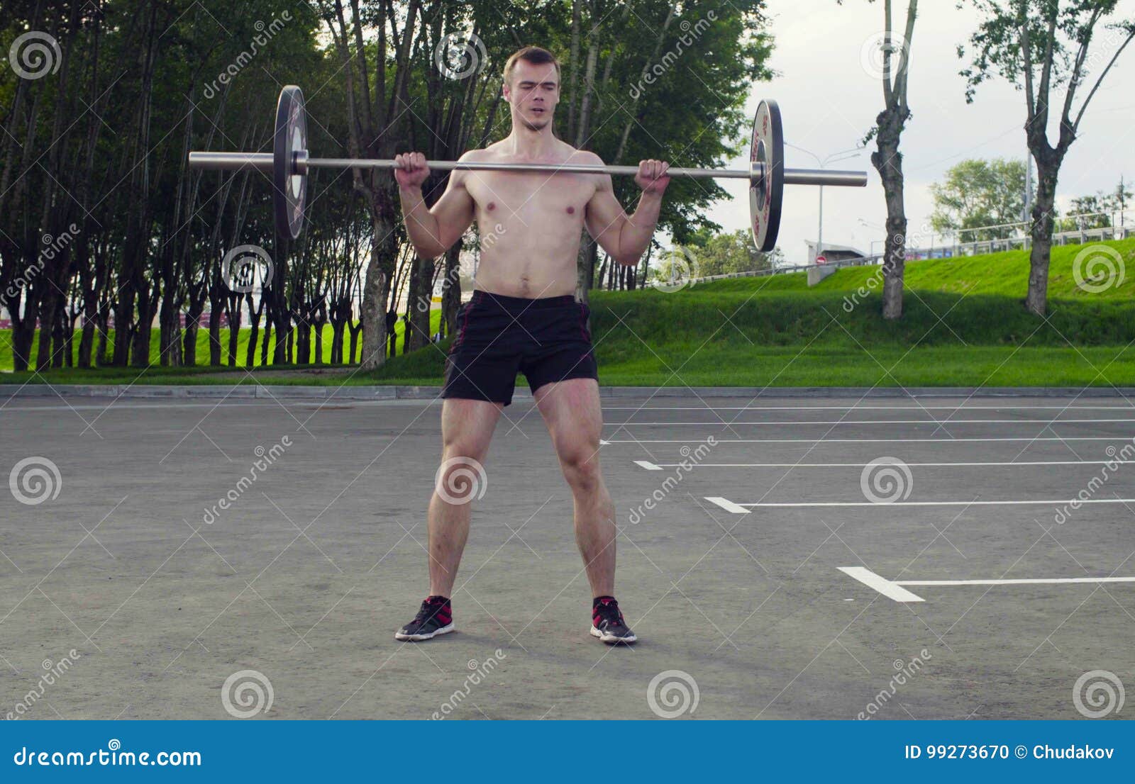 A Young Man is Lifting Barbell Stock Photo - Image of power, athletic ...